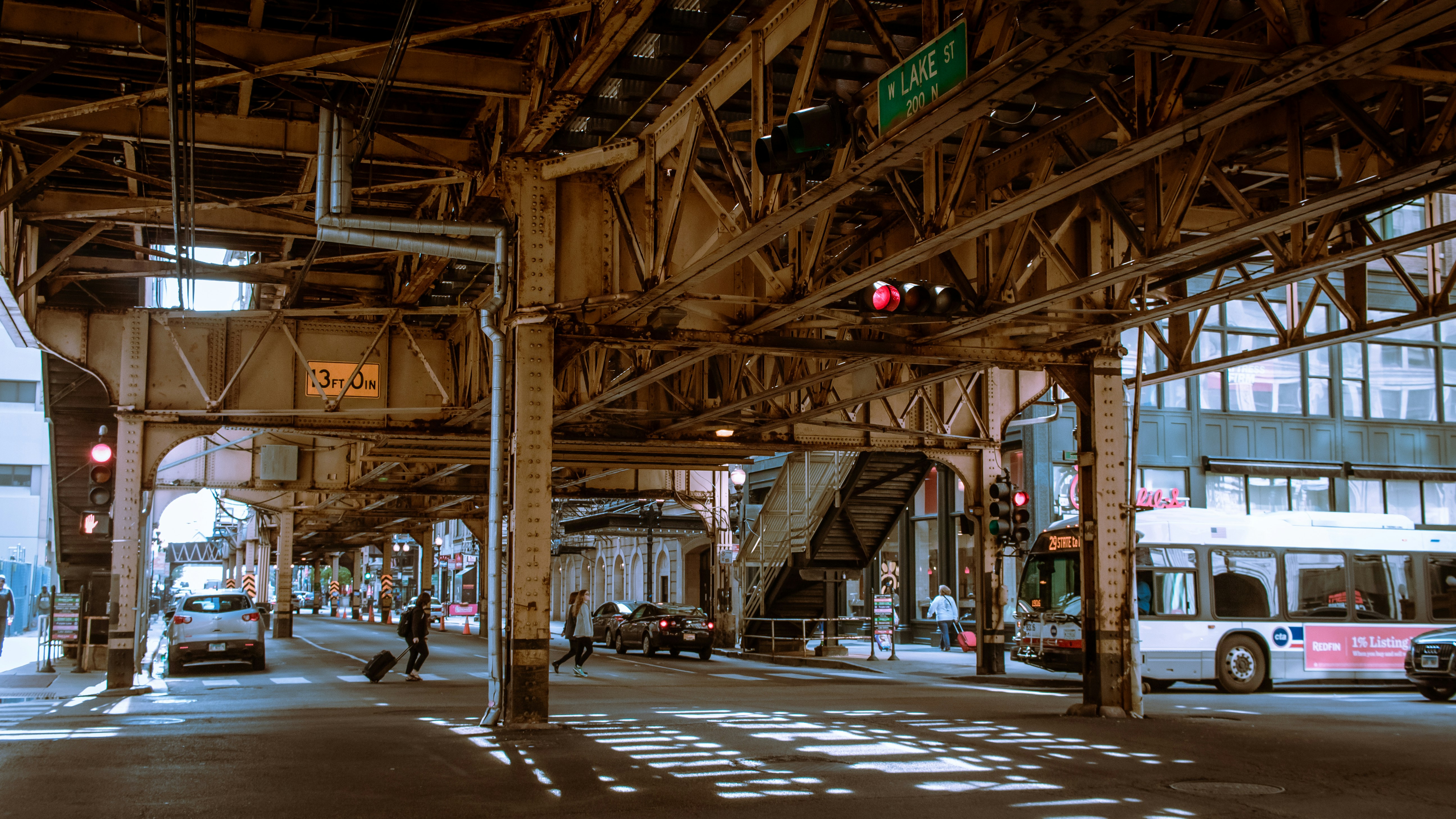 Intersection underneath train railway photo – Free Bus Image on Unsplash
