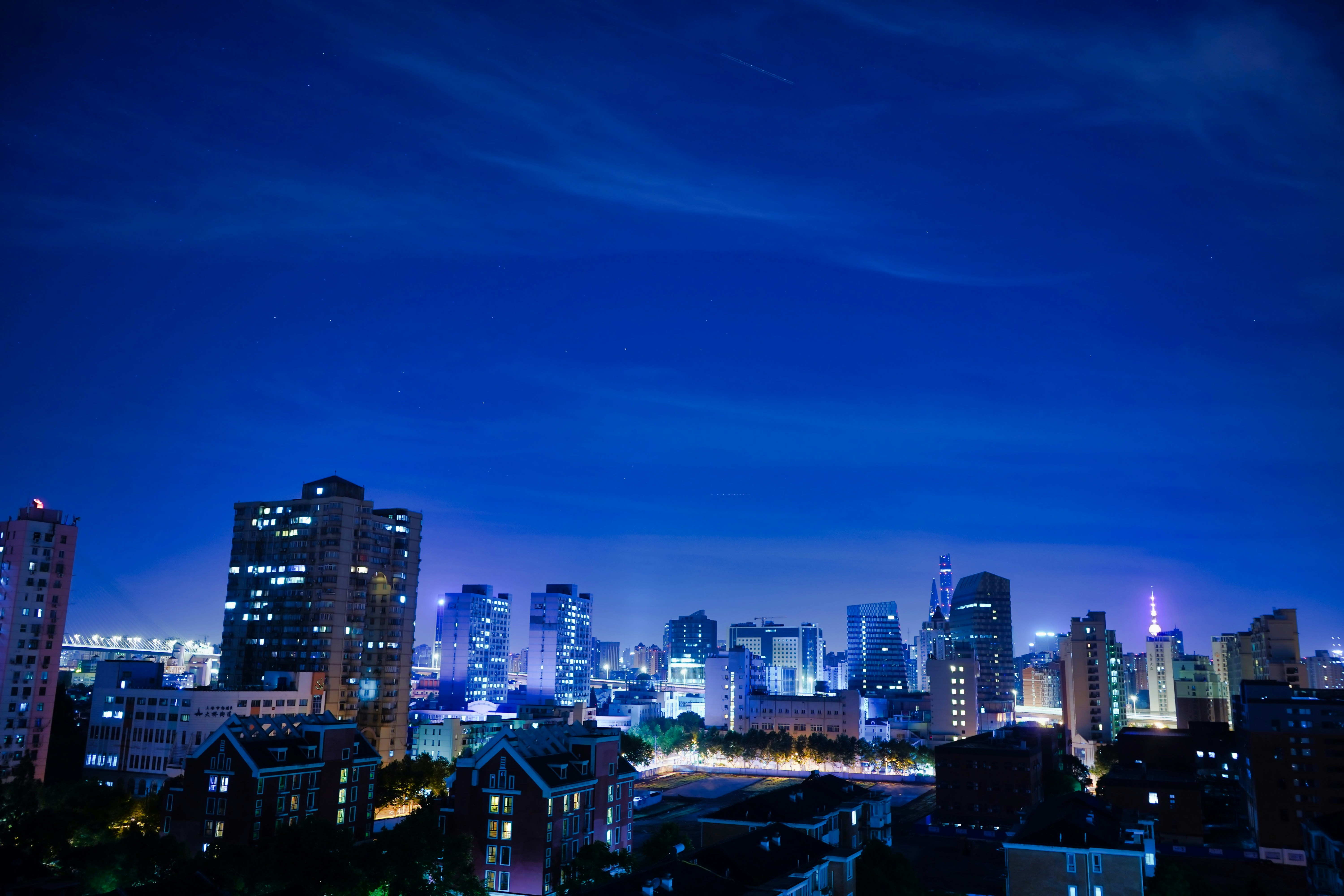 Lighted city buildings during nighttime photo – Free Blue Image on Unsplash