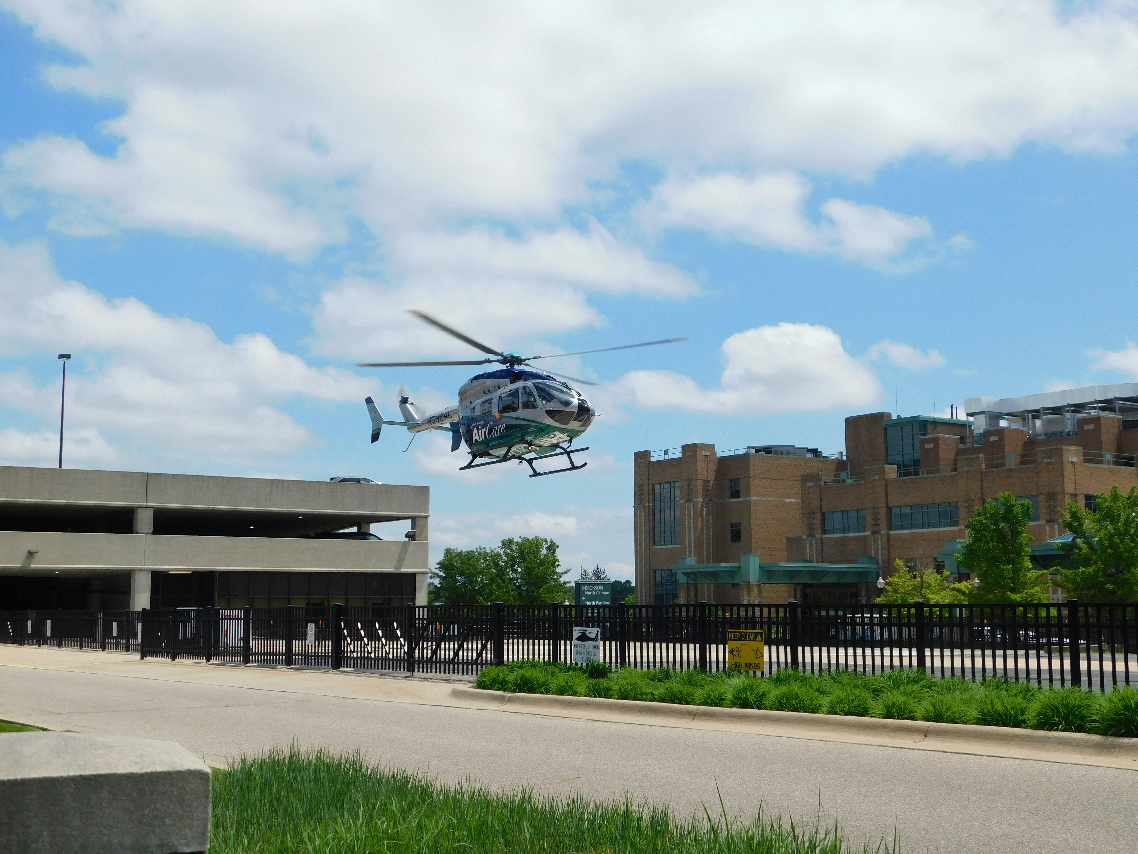Rescue Helipad: A Helicopter Descends Over an Urban Campus