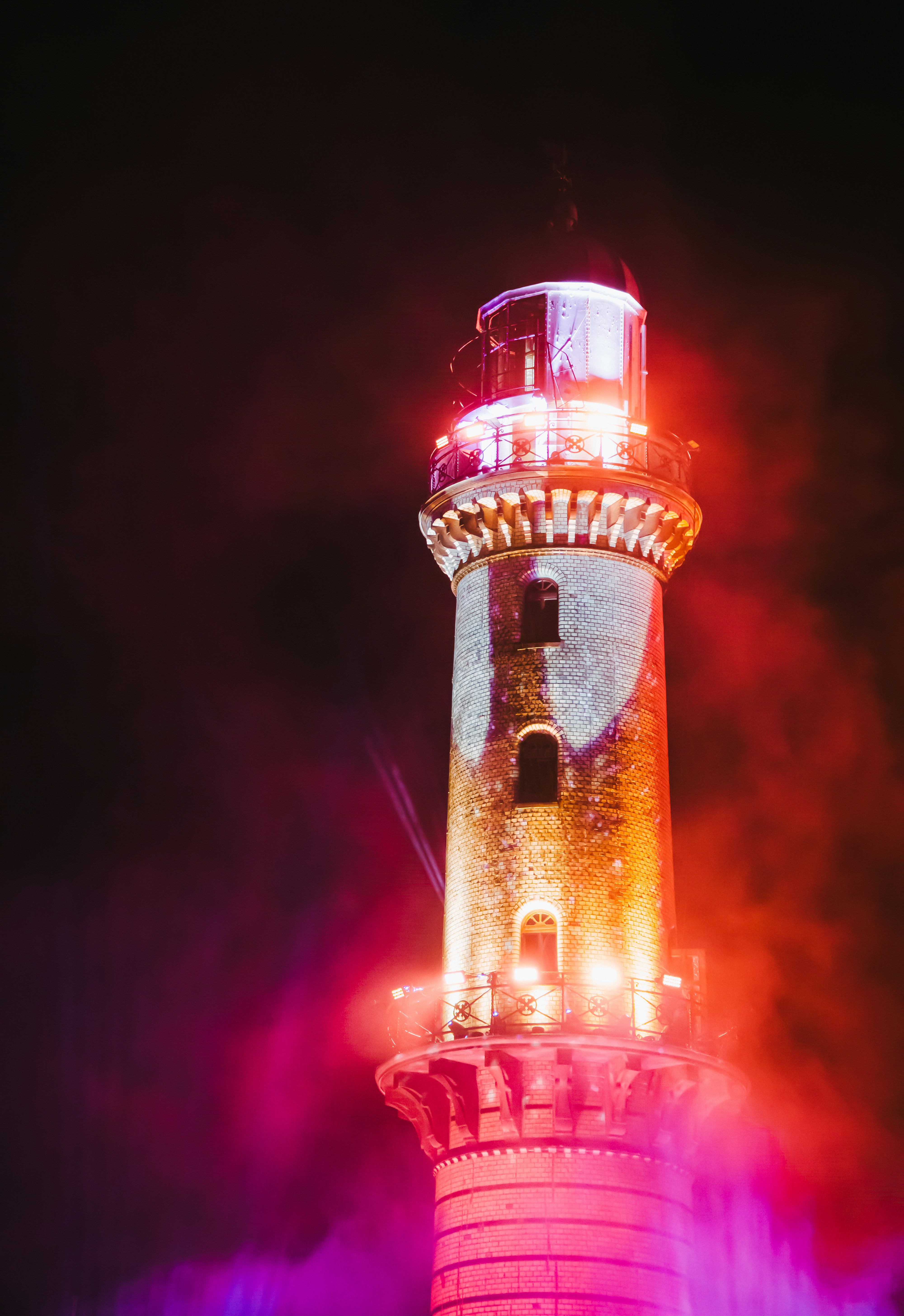 Neon Beacons: A Lighthouse Immersed in Night Queued Light