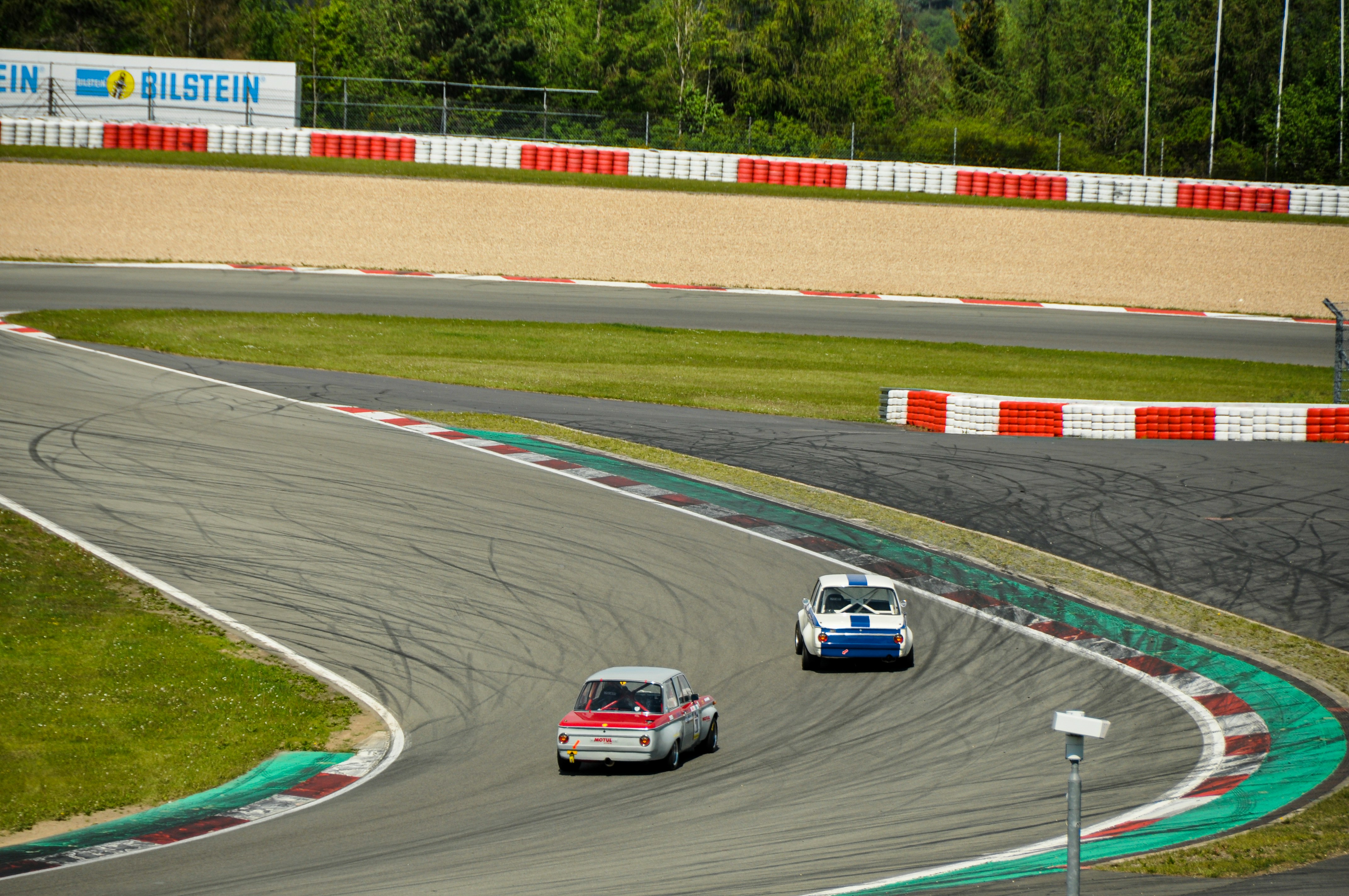 Two racing cars on race track photo – Free Nürburgring Image on Unsplash