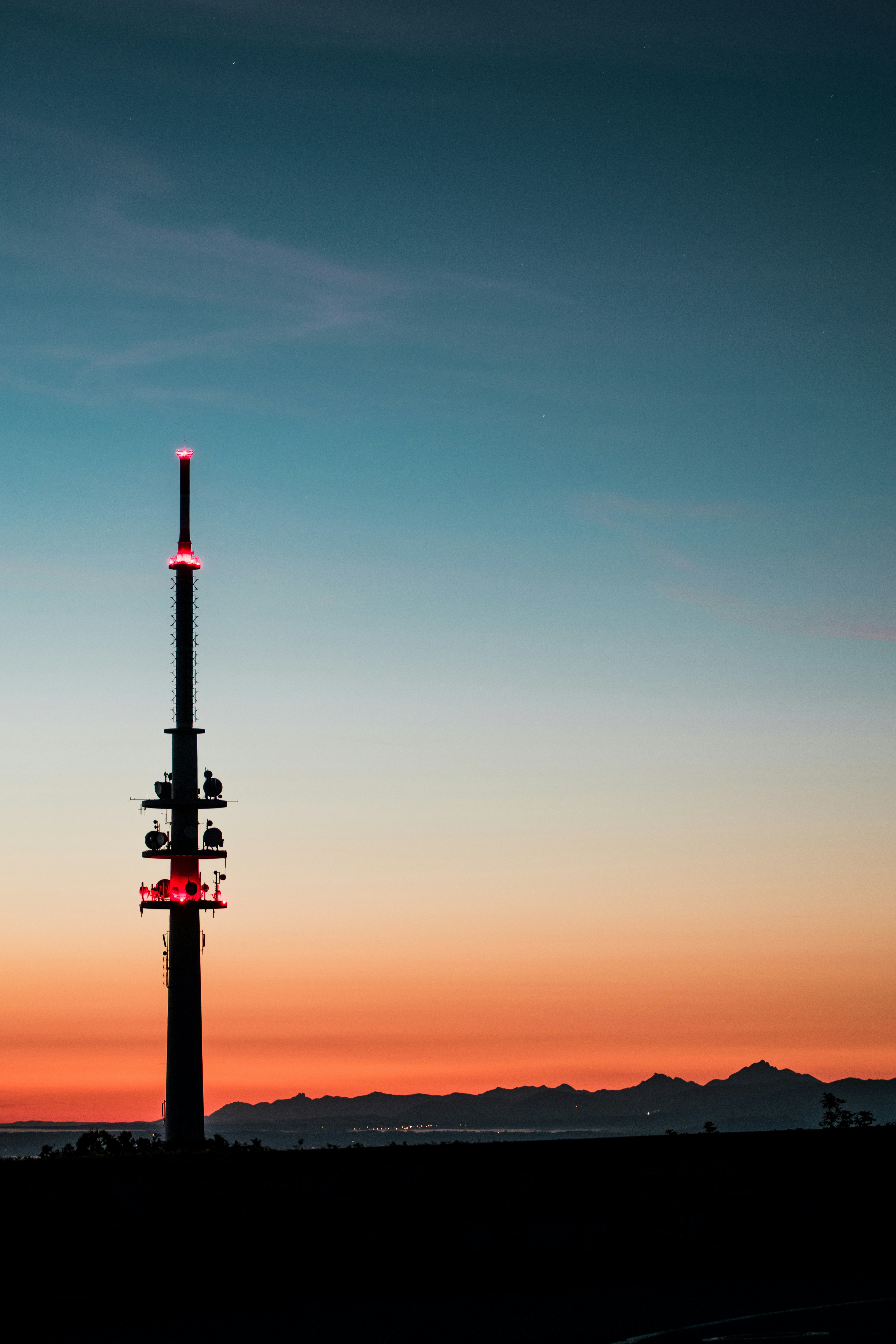 Twin-Tone Signal: Sunset Beacon Rising over a Quiet Horizon