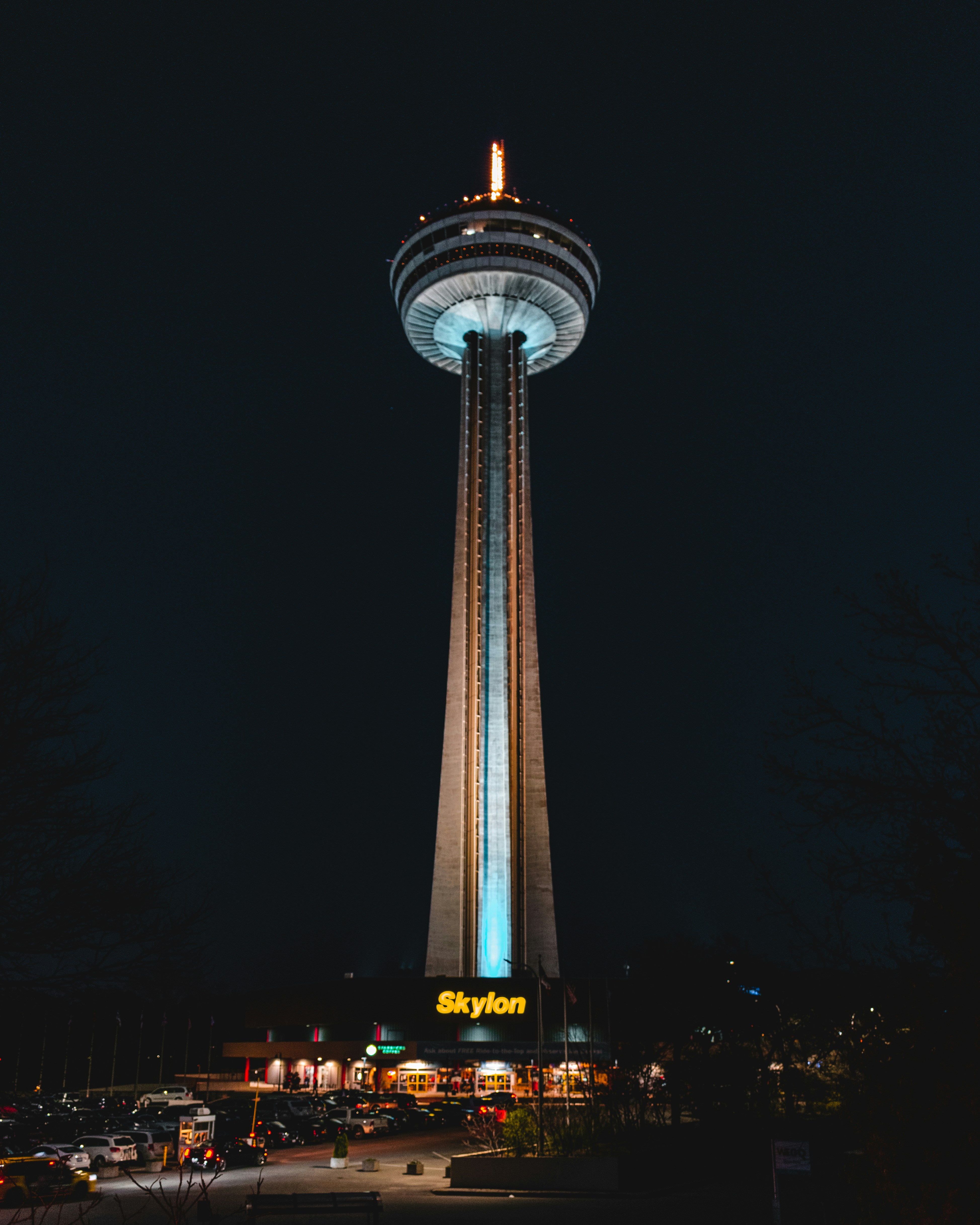 Neon Spine: Skylon Tower Stands Tall in Nightfall