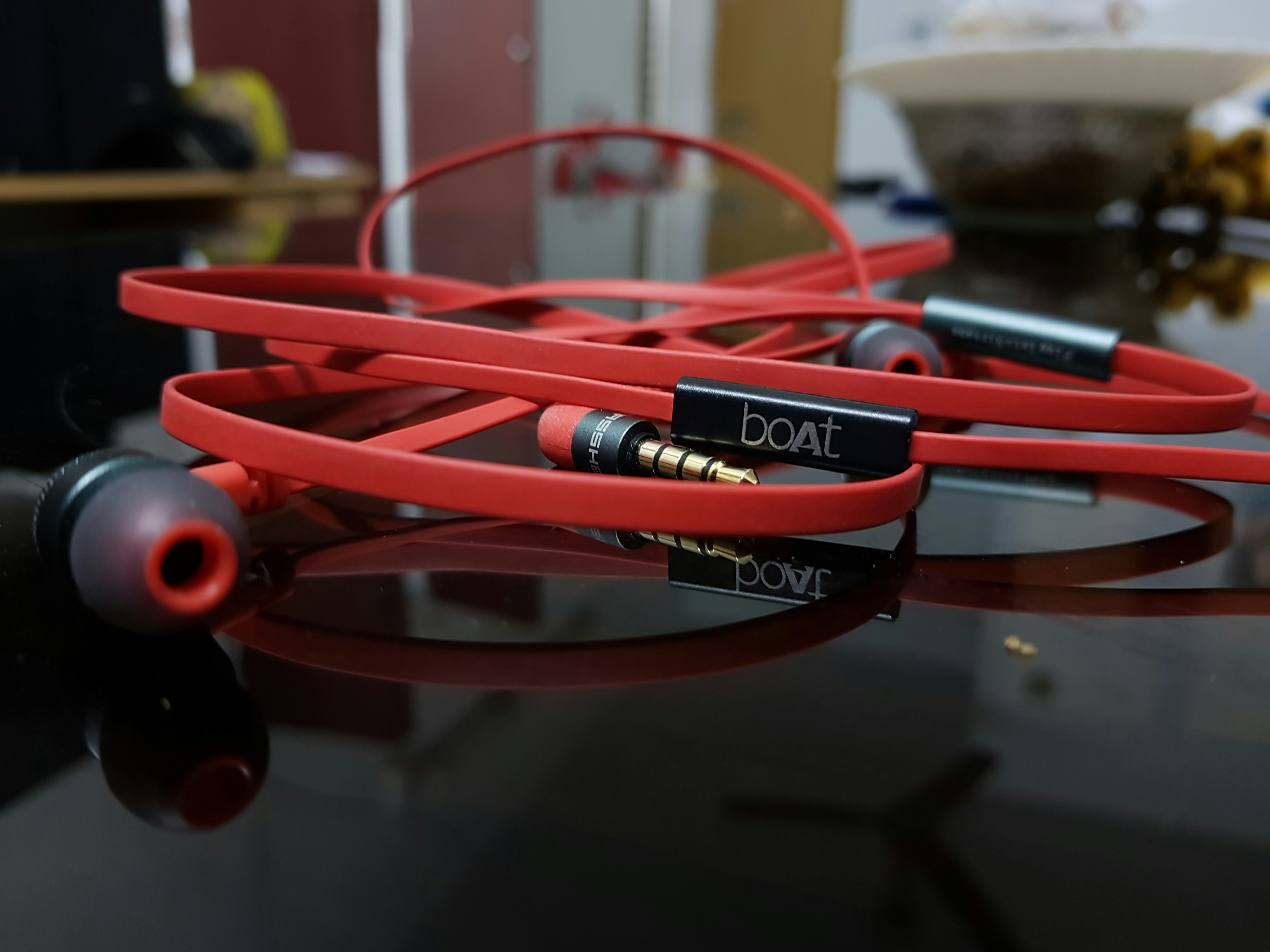 Black and red earbuds photo – Free Brown Image on Unsplash