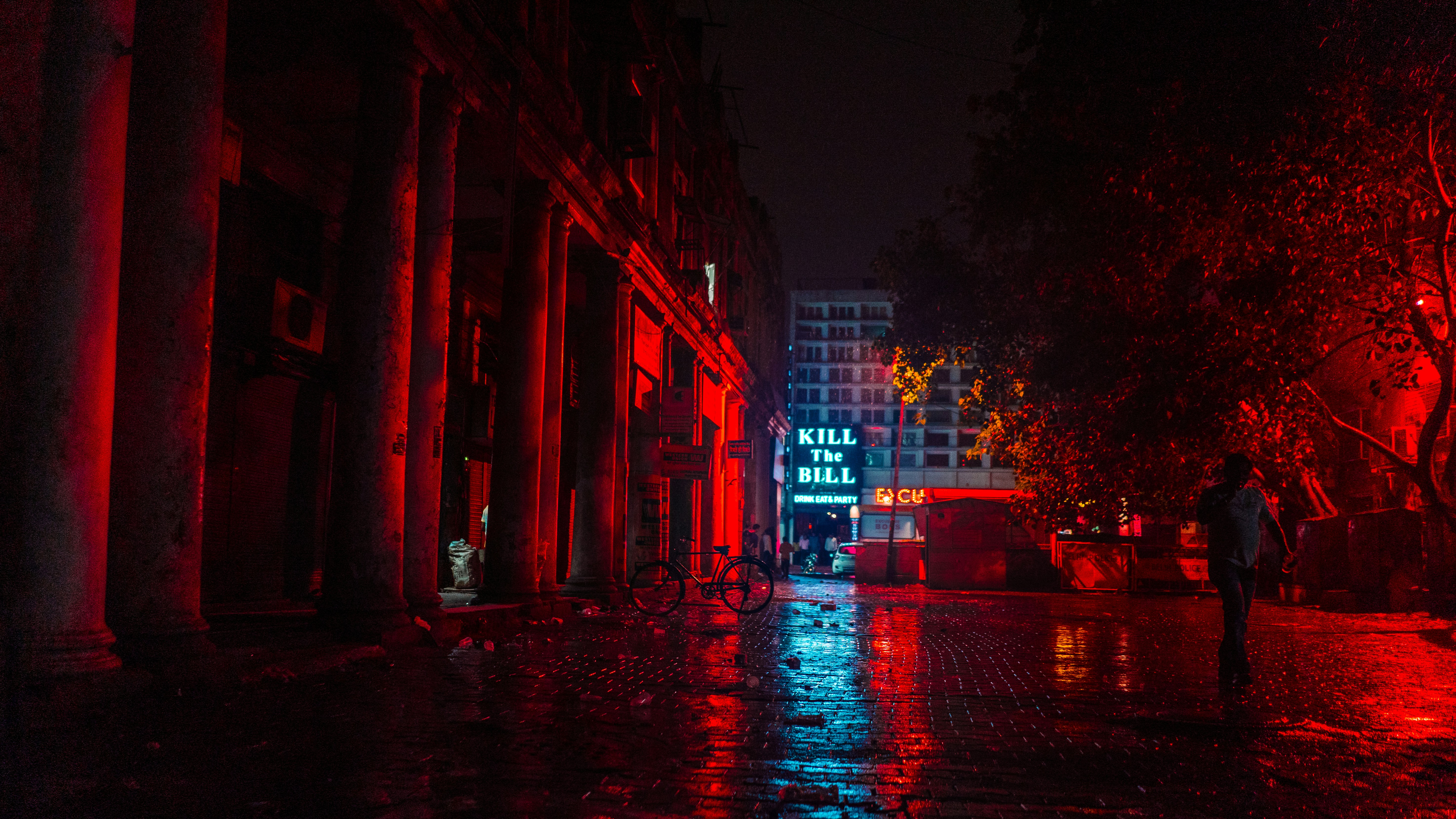 Person walking on sidewalk in front of building photo – Free Human ...
