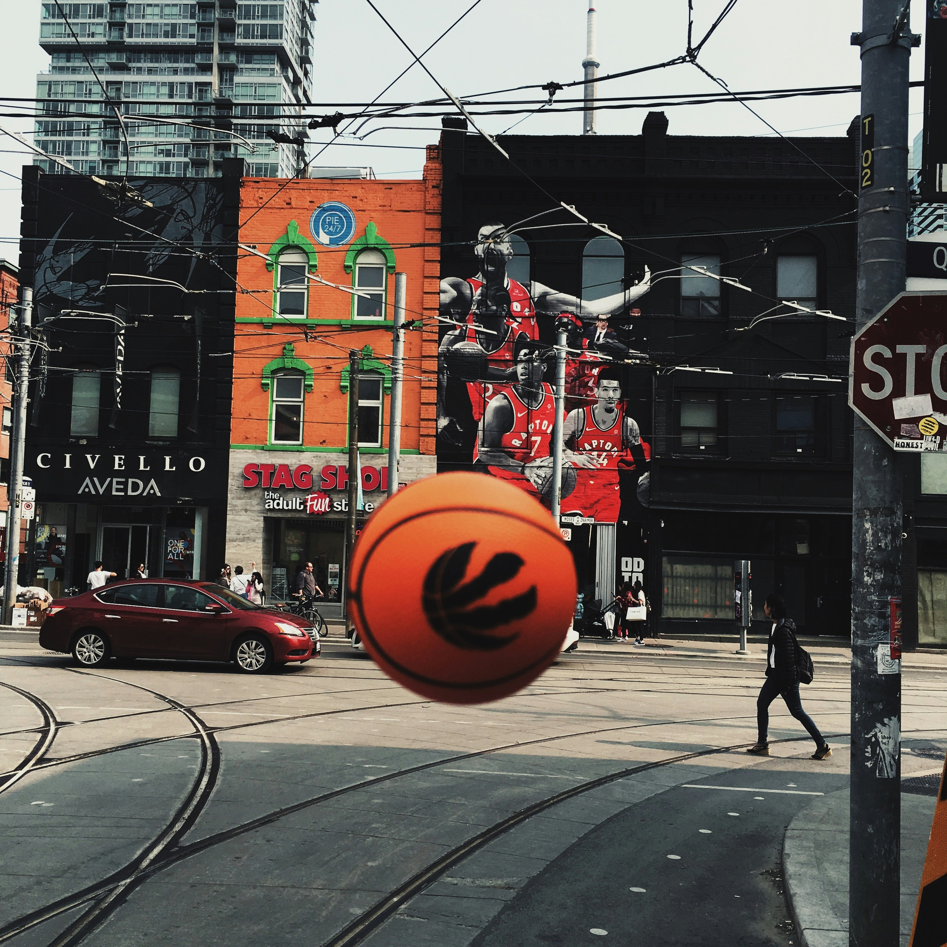 Urban Basket: A Lens-Curved Ball Hovers Over City Street