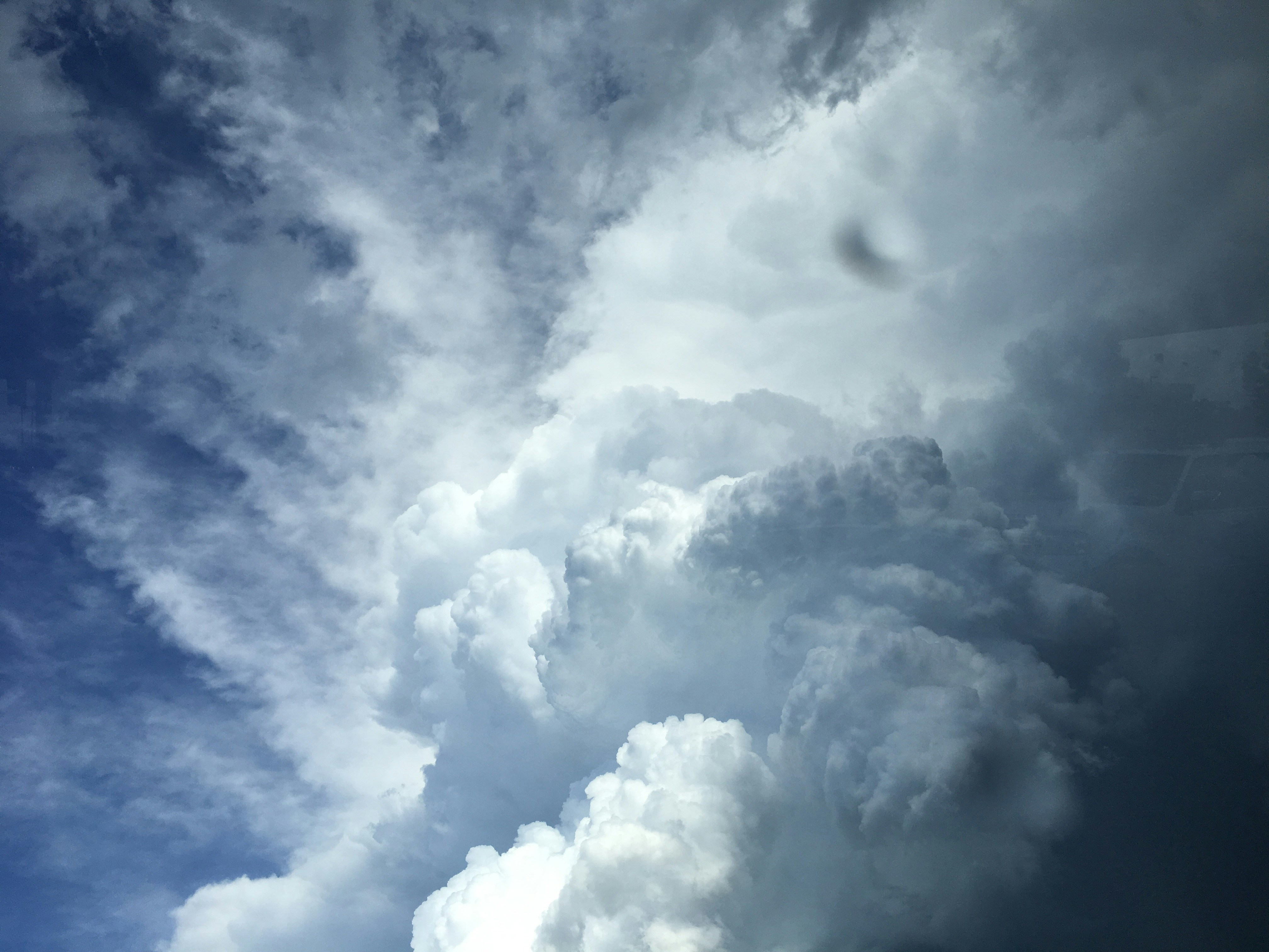 Dramatic clouds with clear blue sky photo – Free Clouds Image on Unsplash