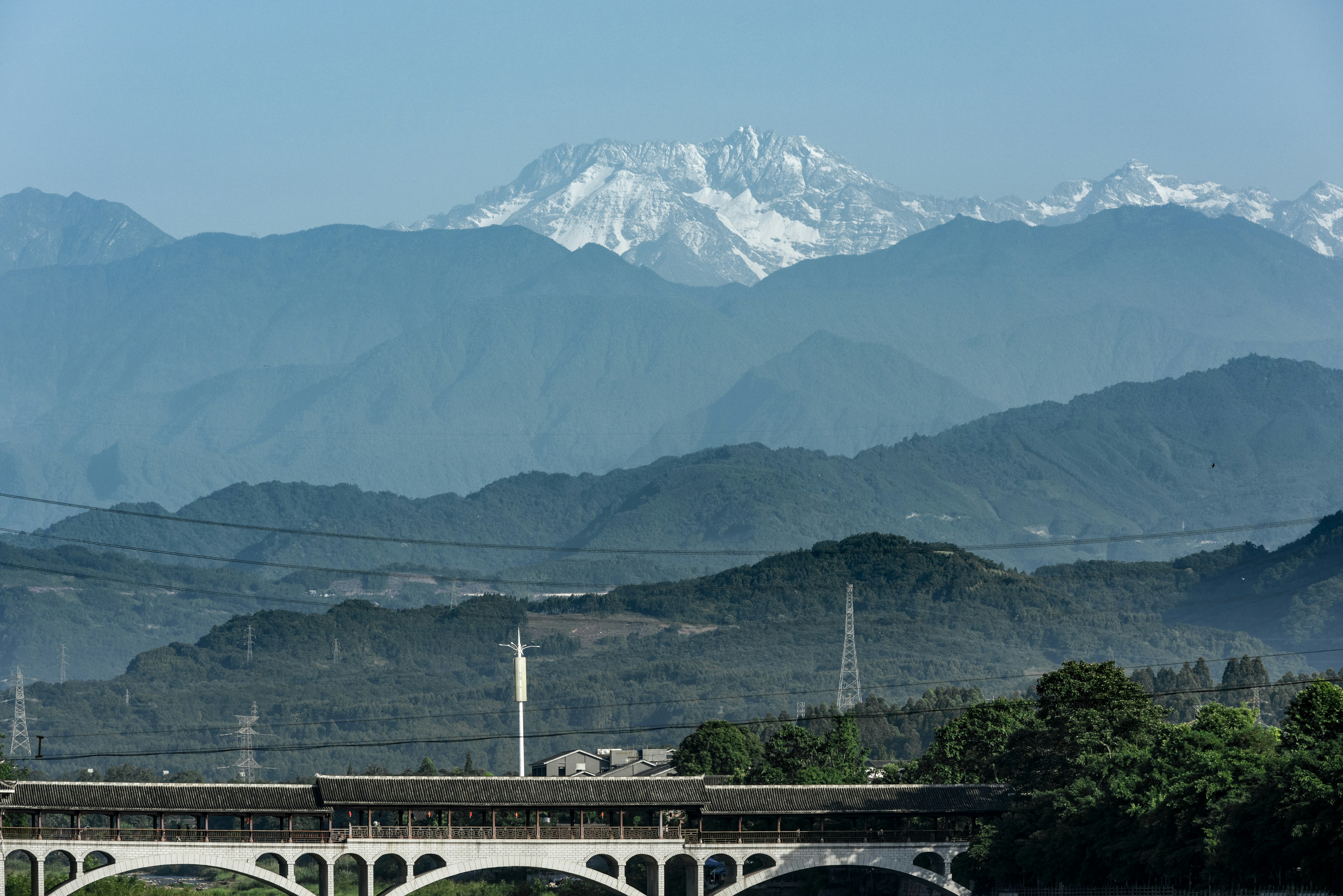 Grey covered bridge at the foot of mountain photo – Free Grey Image on ...