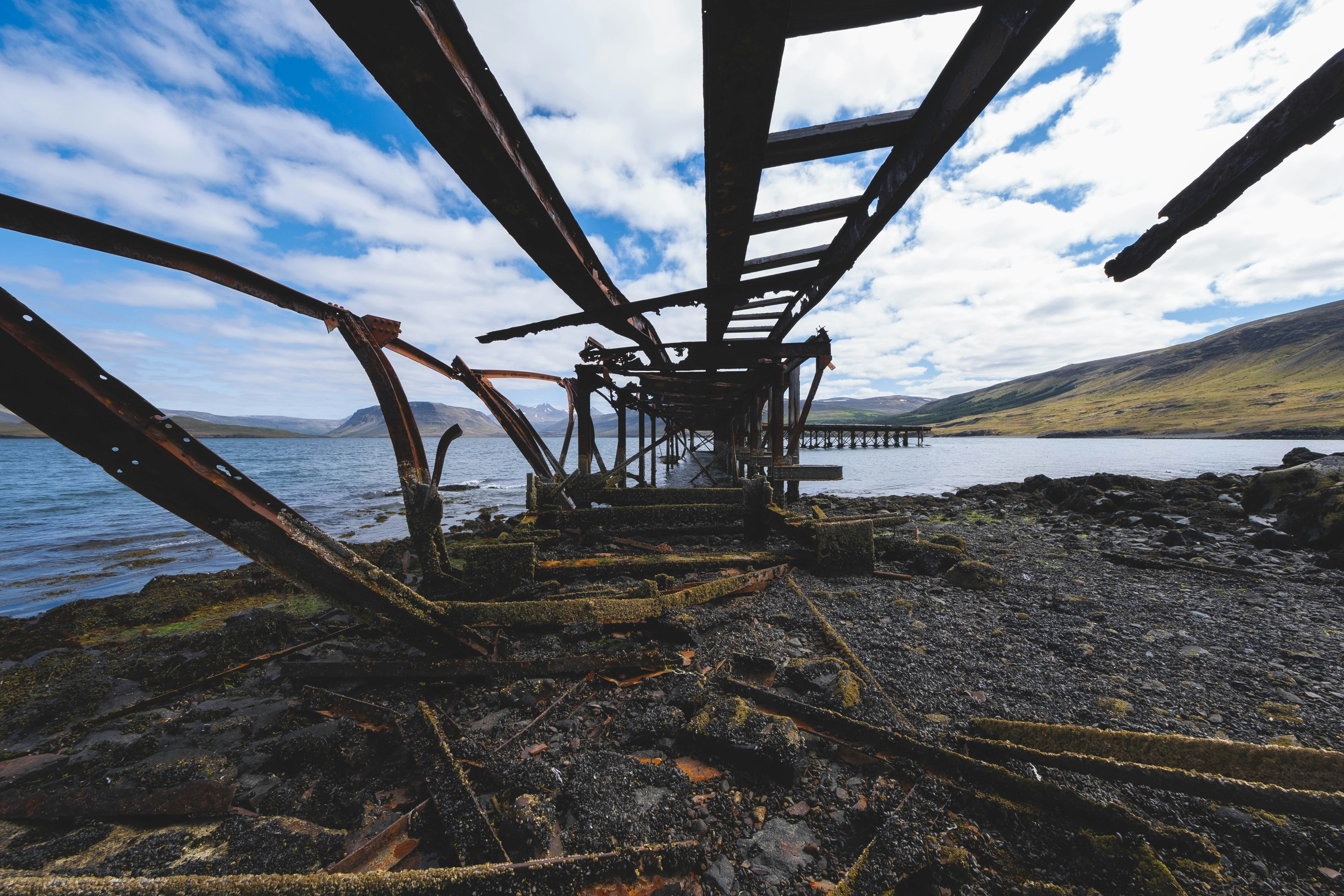 Rusted Rails Stretch Toward the Open Water