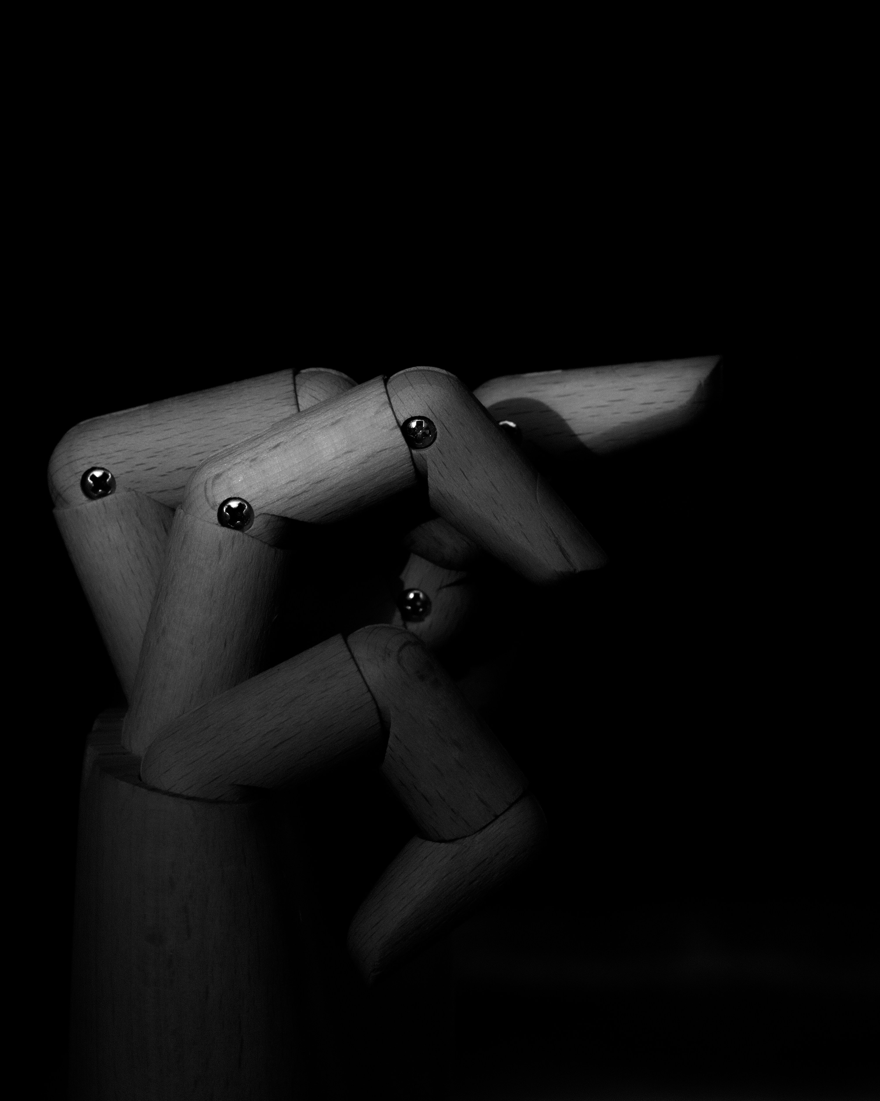 Stilled in Wood: A Quiet Pivot of Placed Fingers