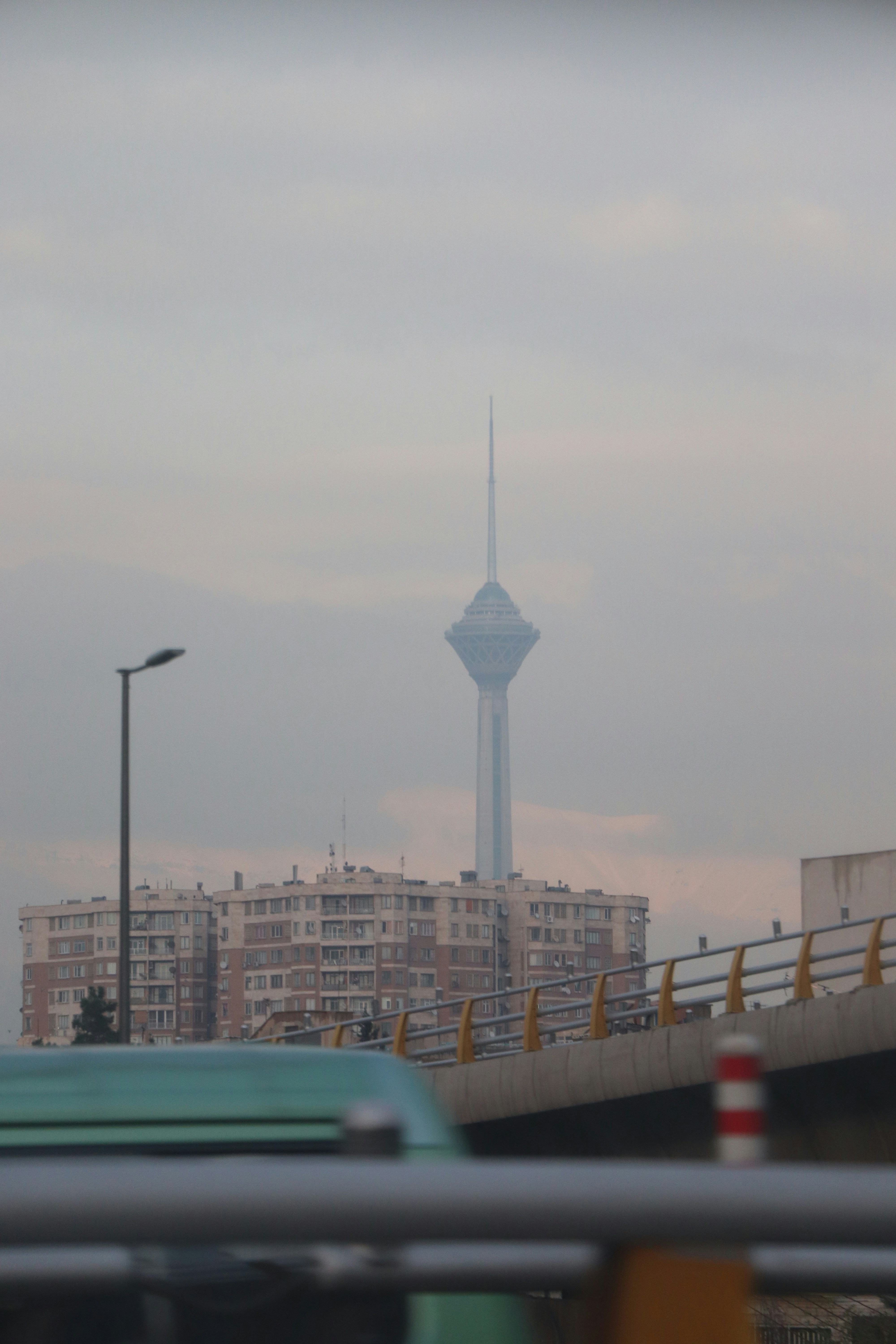 grey tower seen across expressway