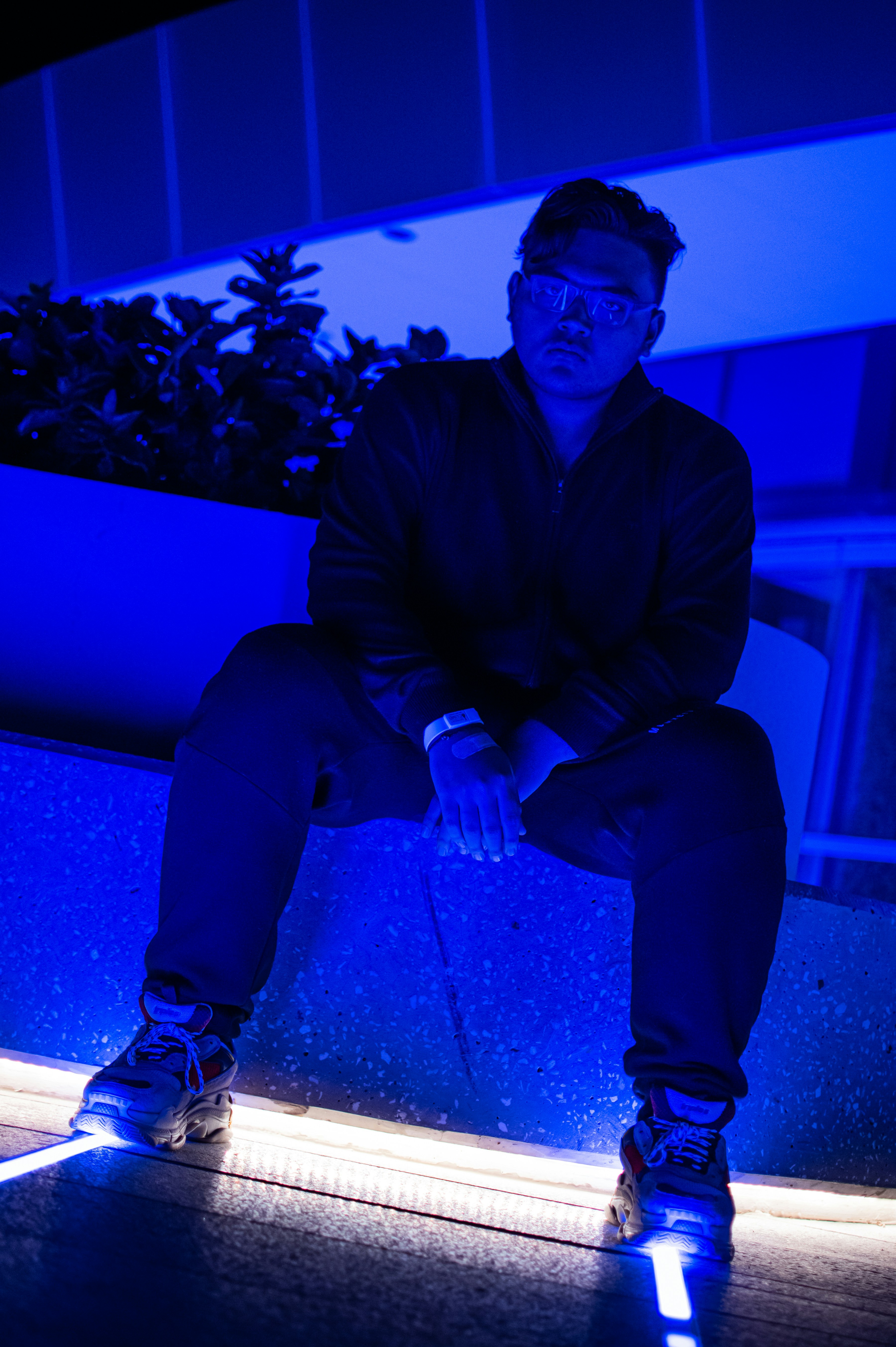 unknown person sitting outdoors
