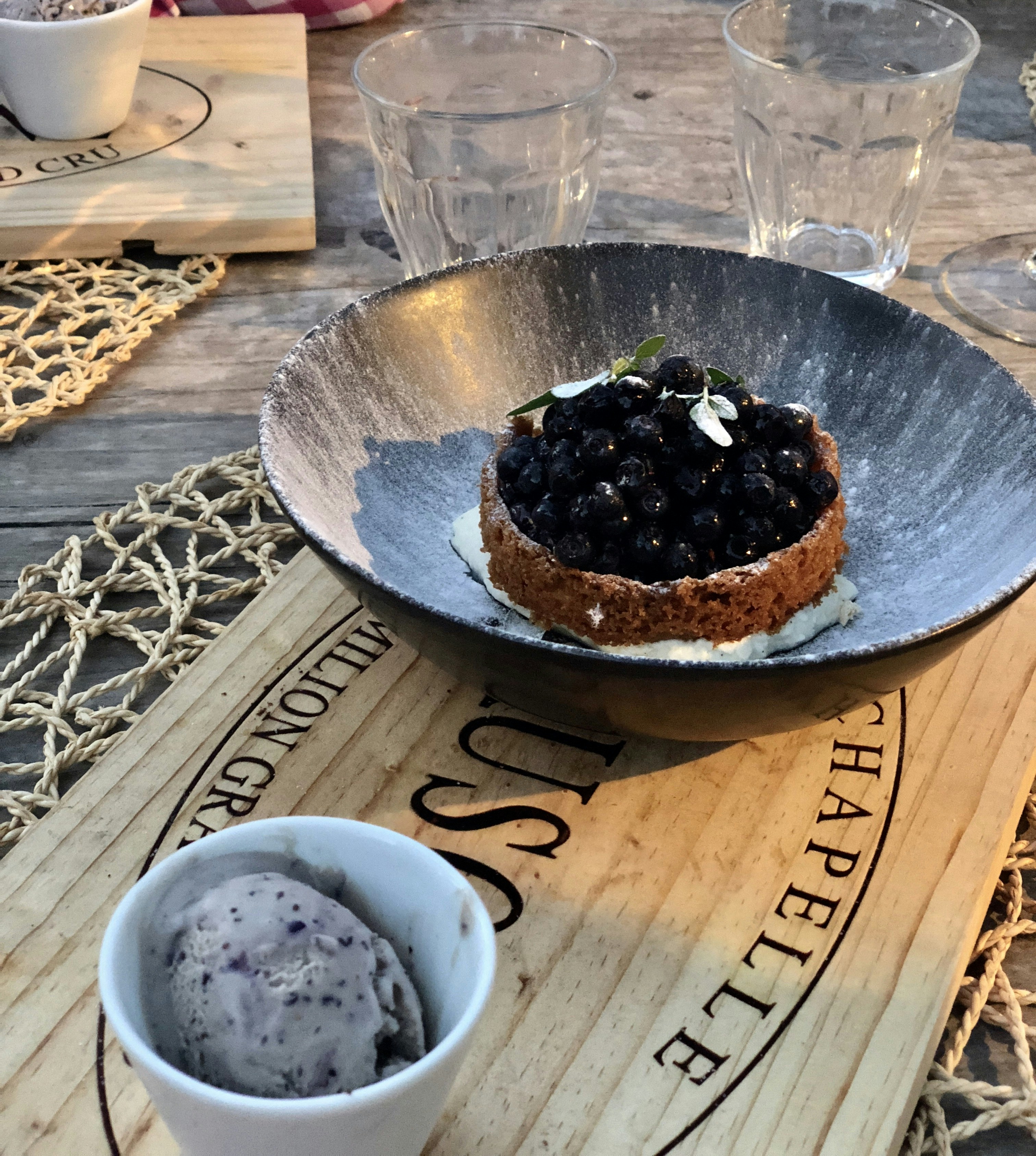 Blueberry-topped tart on a rustic wooden table