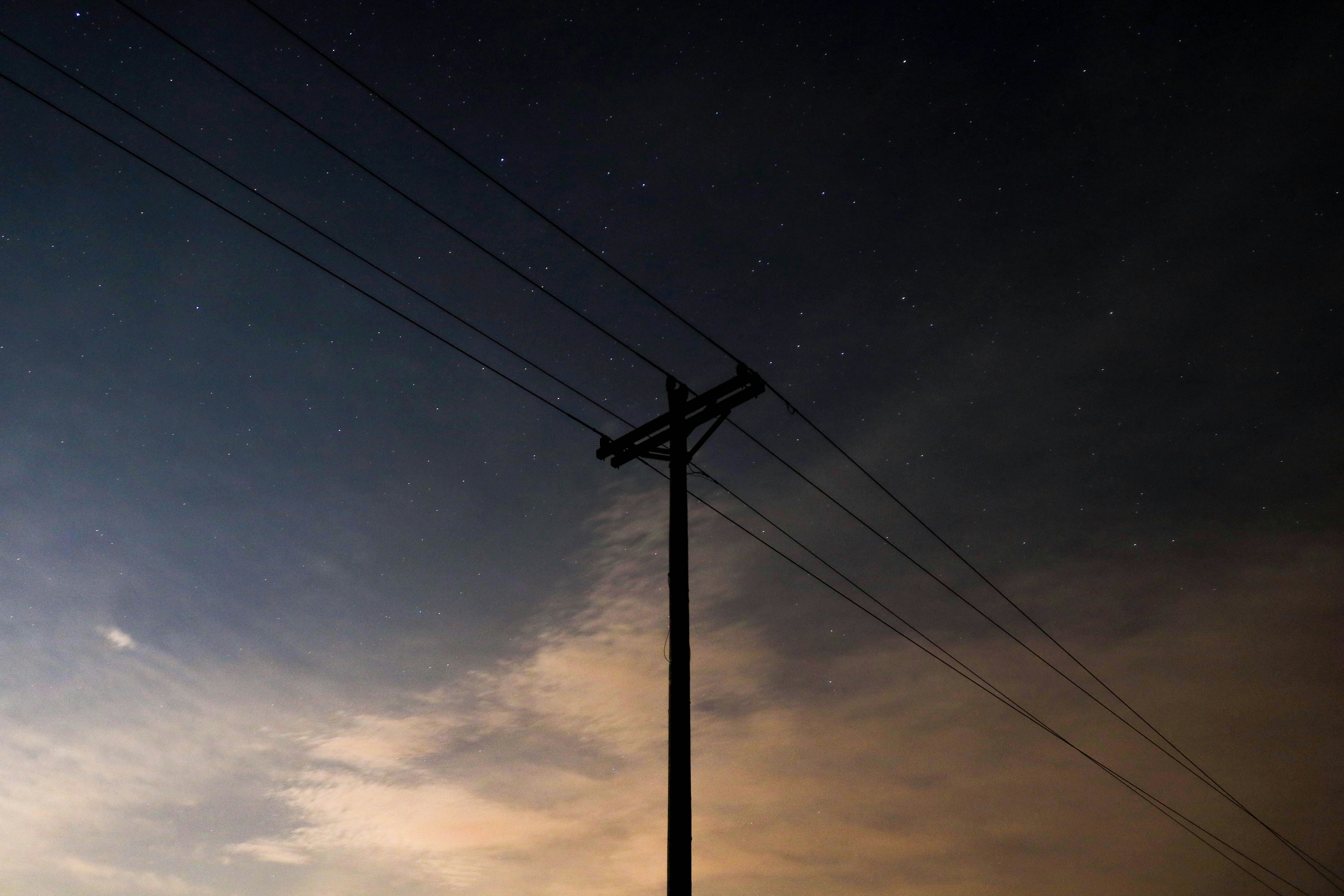 Power Lines Beneath a Starry Dusk