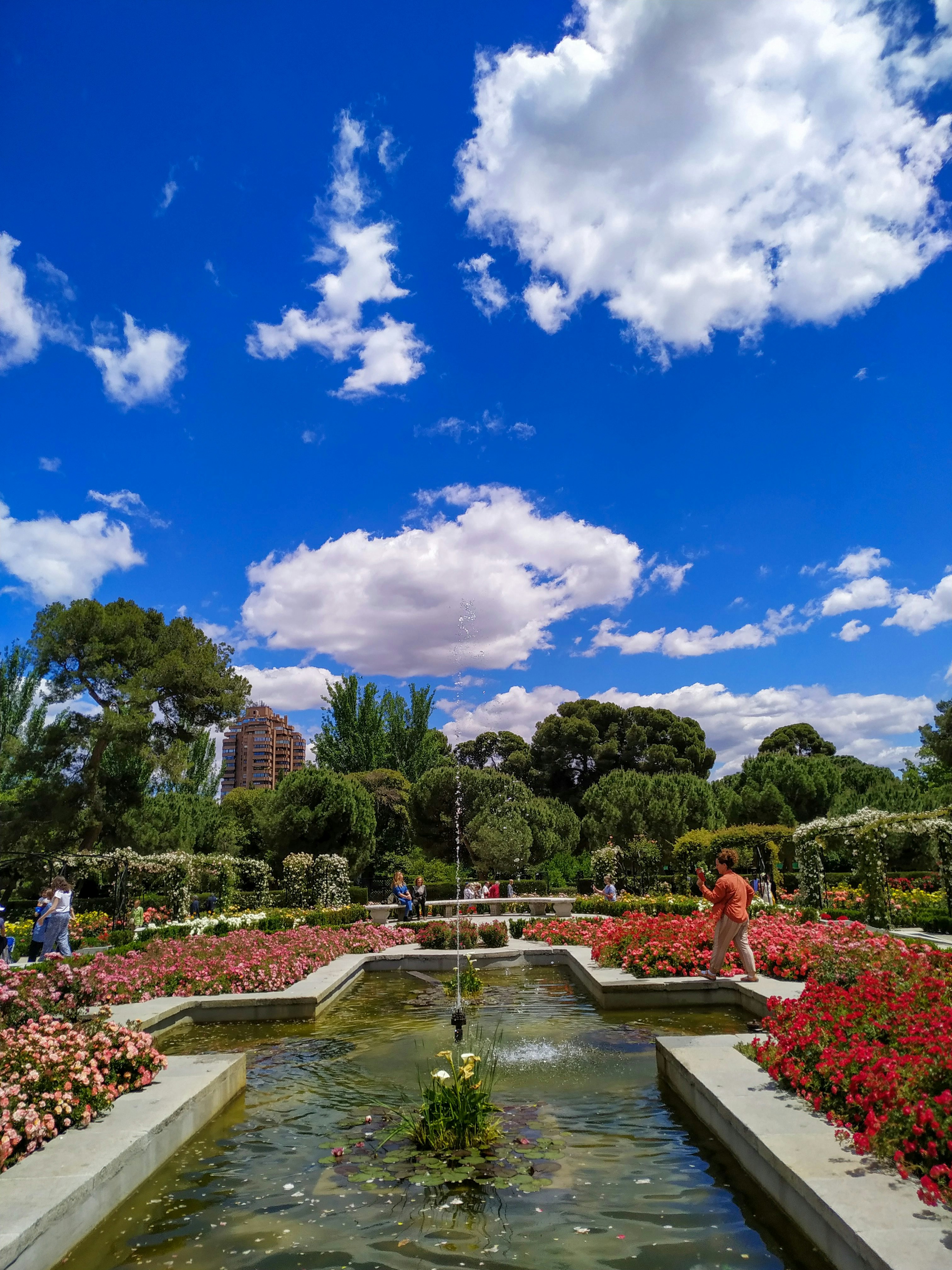 Cerulean Sky Over a Parterre Garden Framed by a Central Fountain