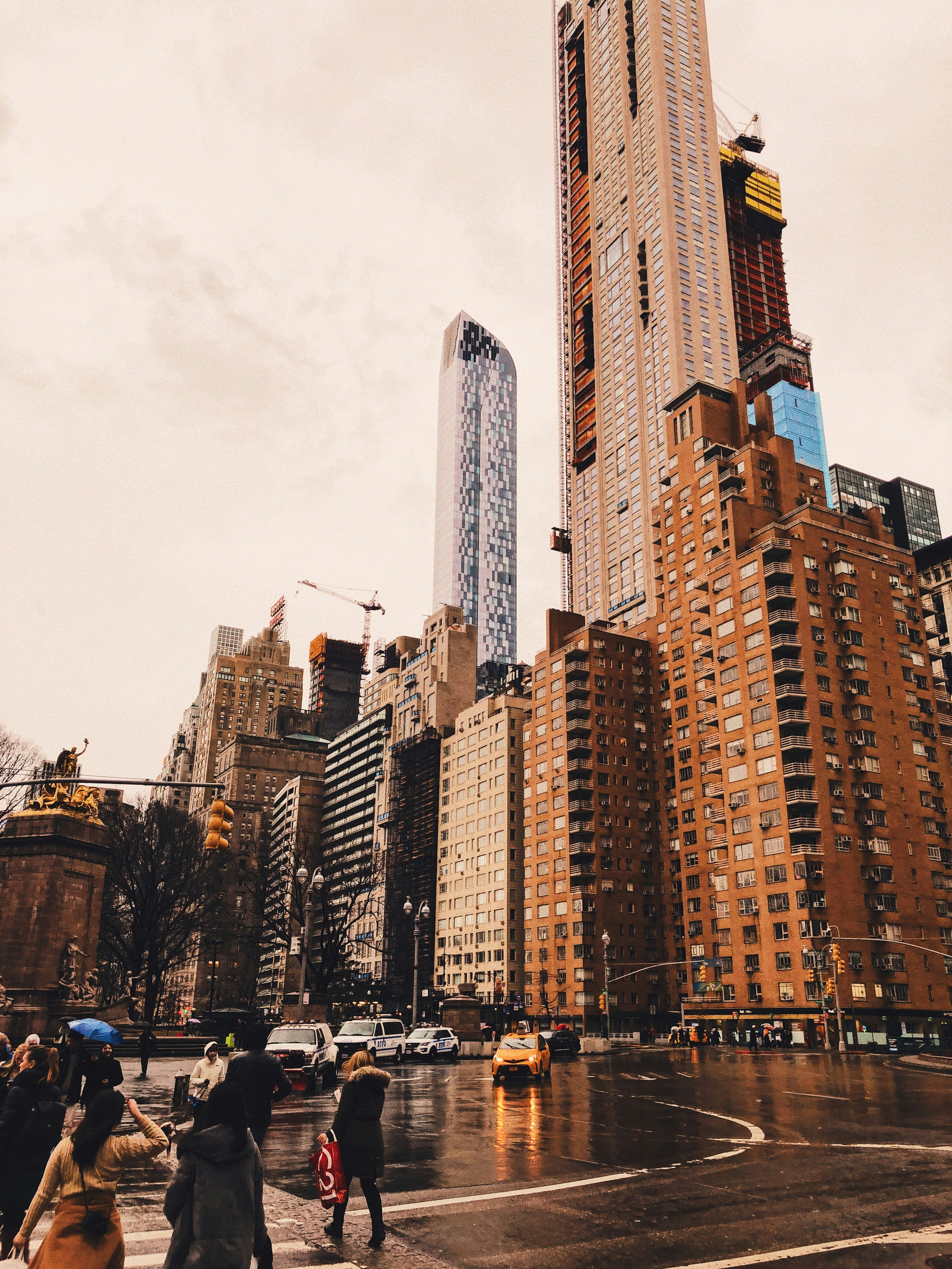 Brown concrete high-rise building photo – Free Human Image on Unsplash