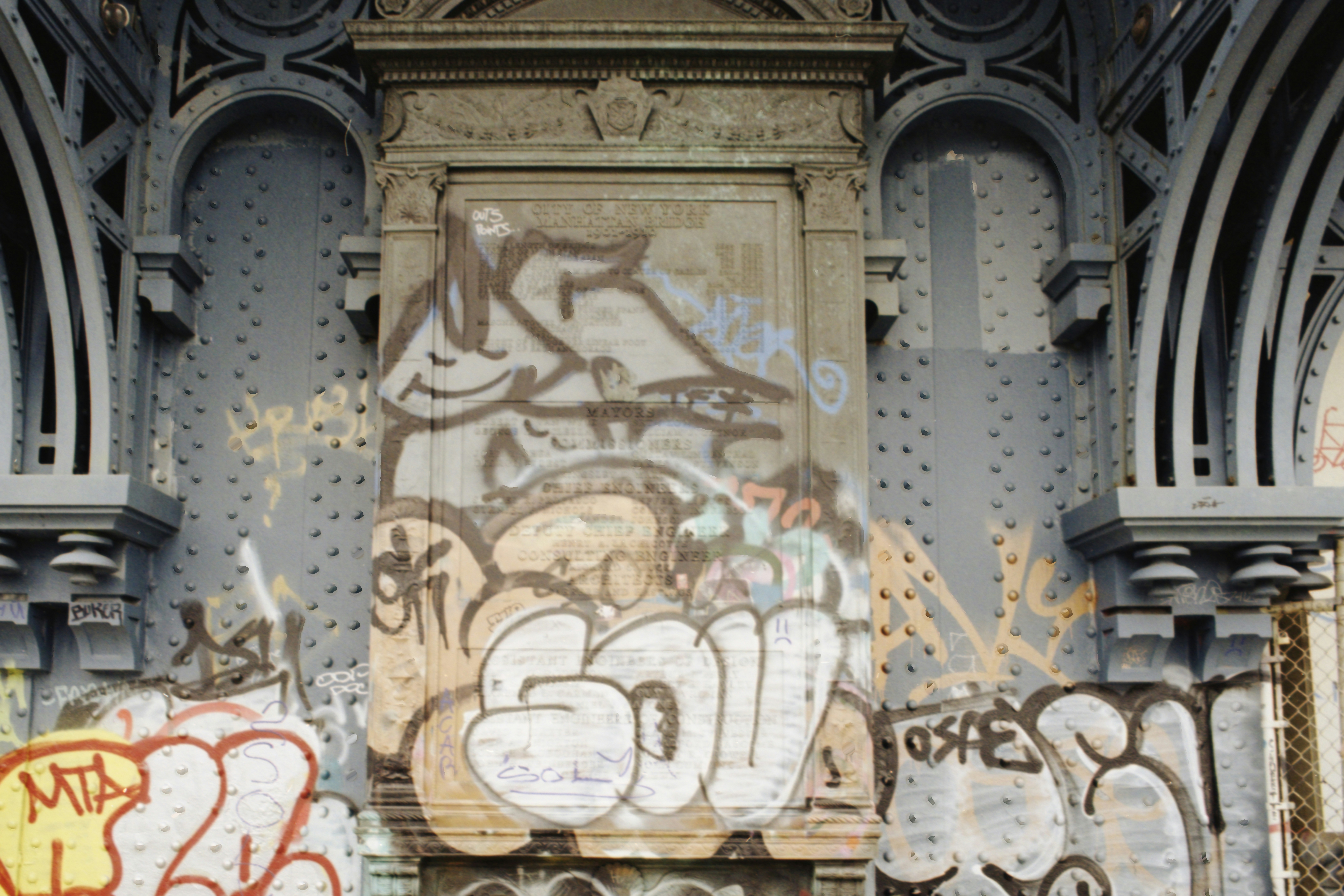 Central Graffiti Panel Framed by Time-Worn Ironwork