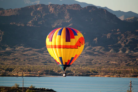 Vibrant Ascent over Desert Waters