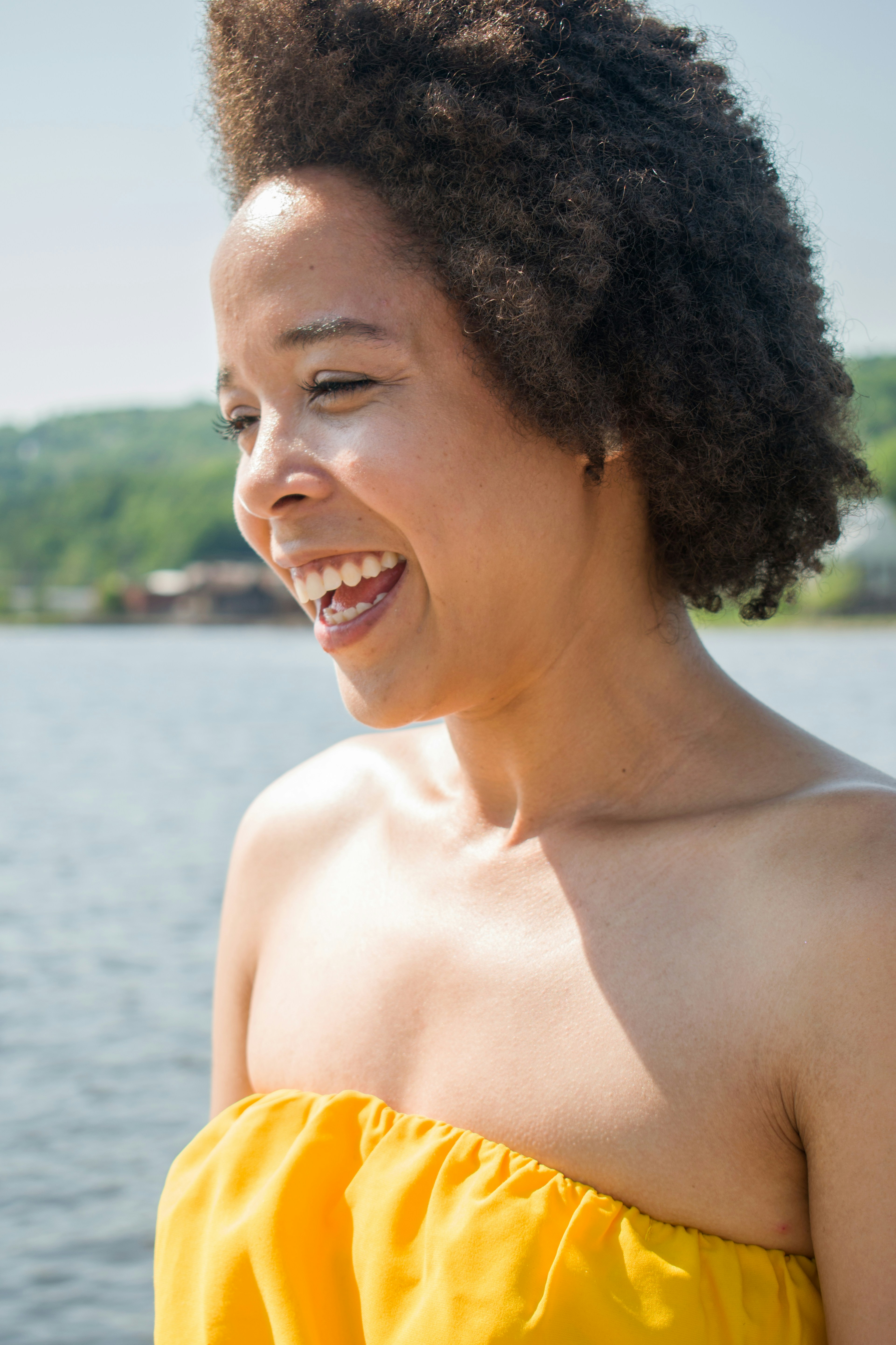 Sunlit Smile by the Lake: Golden Hour Joy in a Yellow Off-Shoulder Top