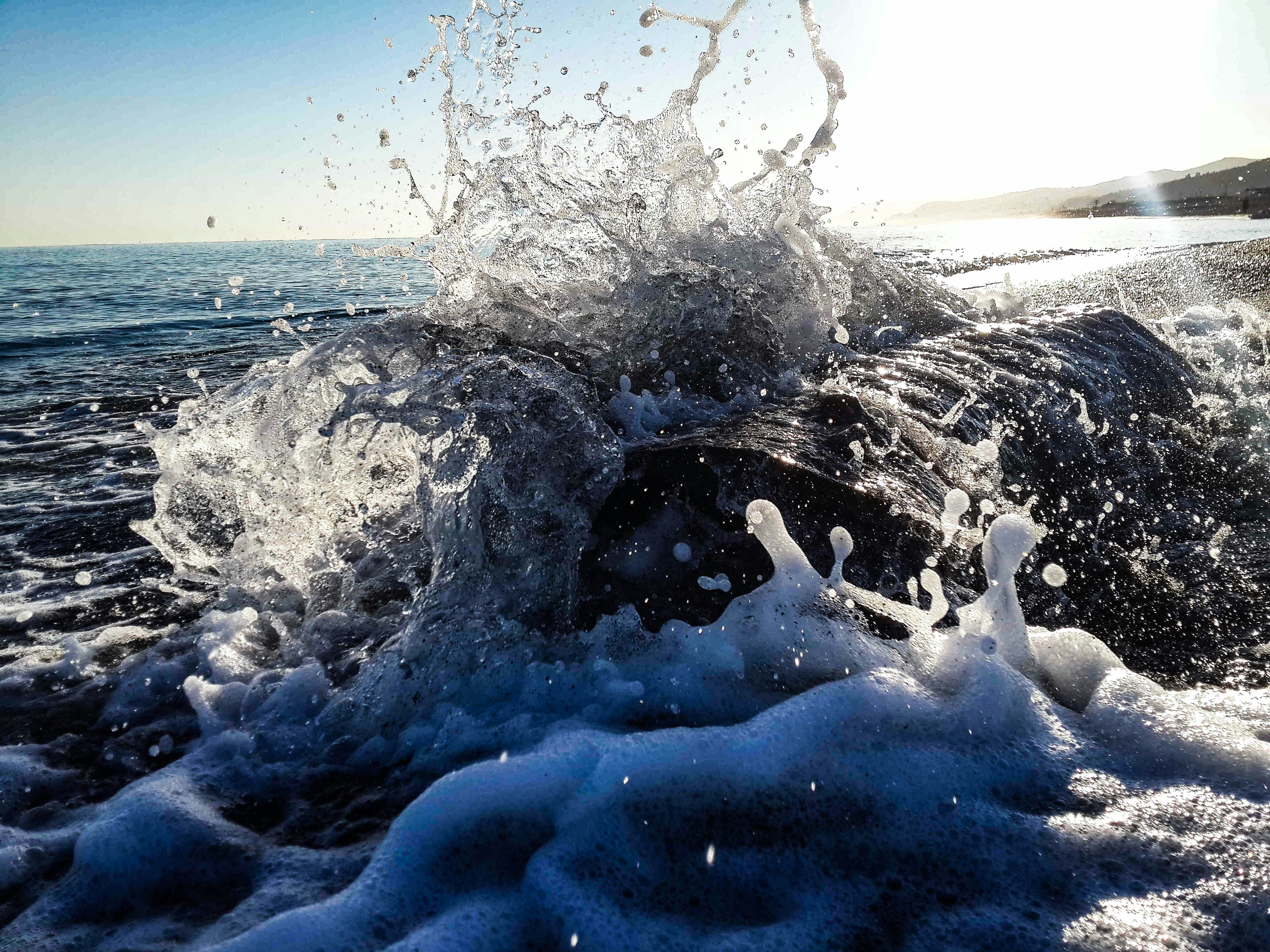 Sunlit Crest: Foam Explodes in a Sea of Light