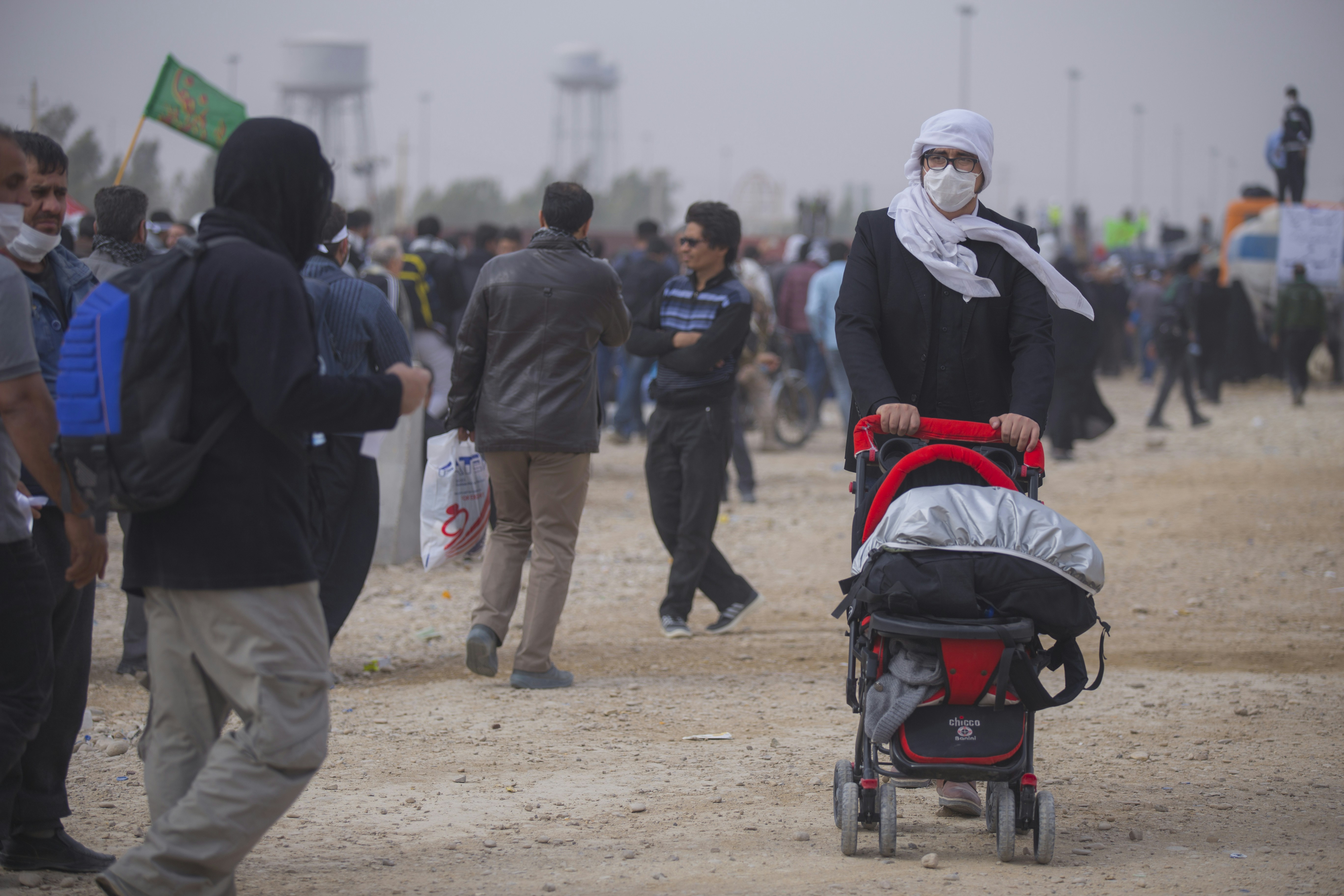 Unknown person pushing black and red stroller outdoors photo – Free ...