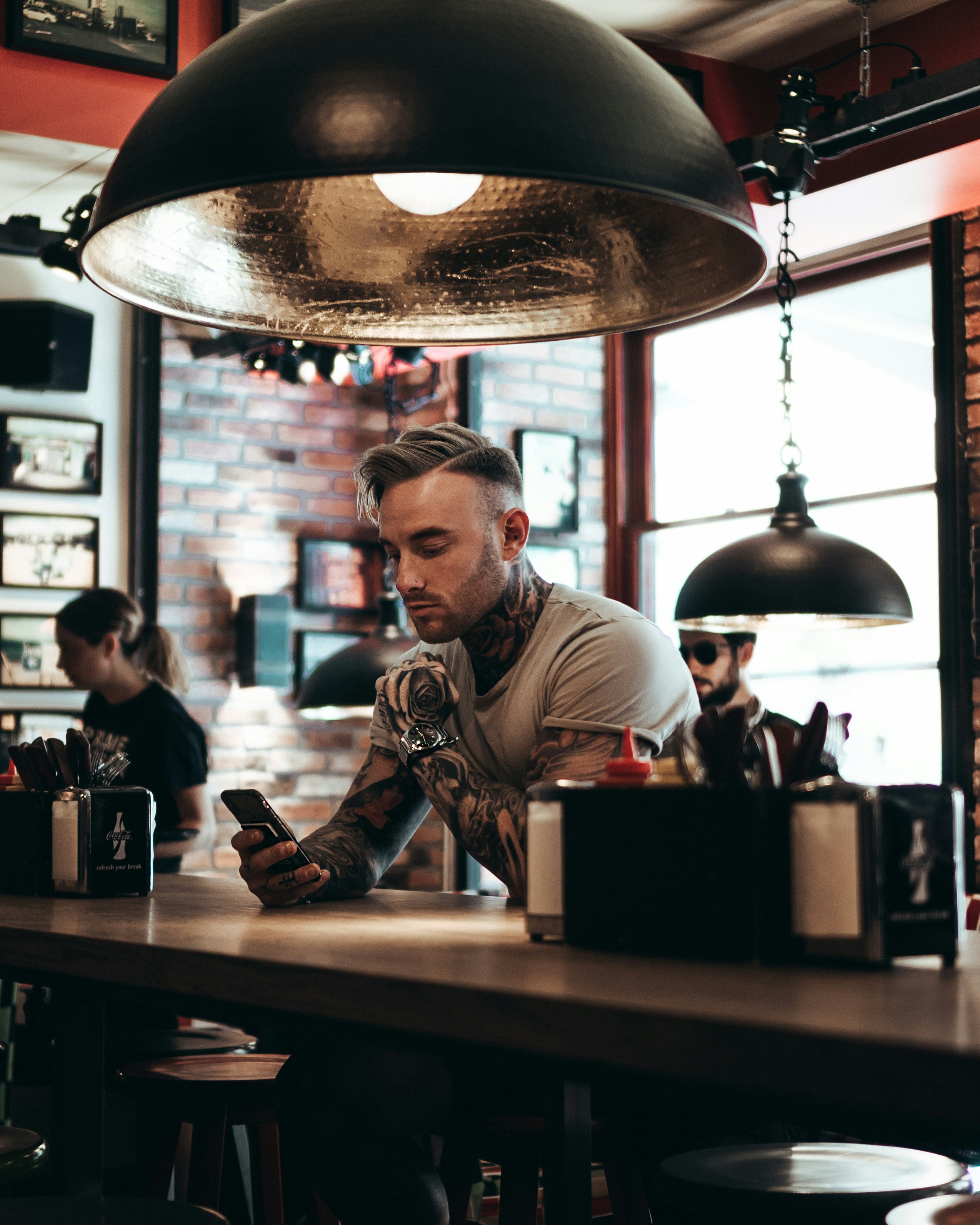 Man sitting beside bar counter photo – Free Restaurant Image on Unsplash