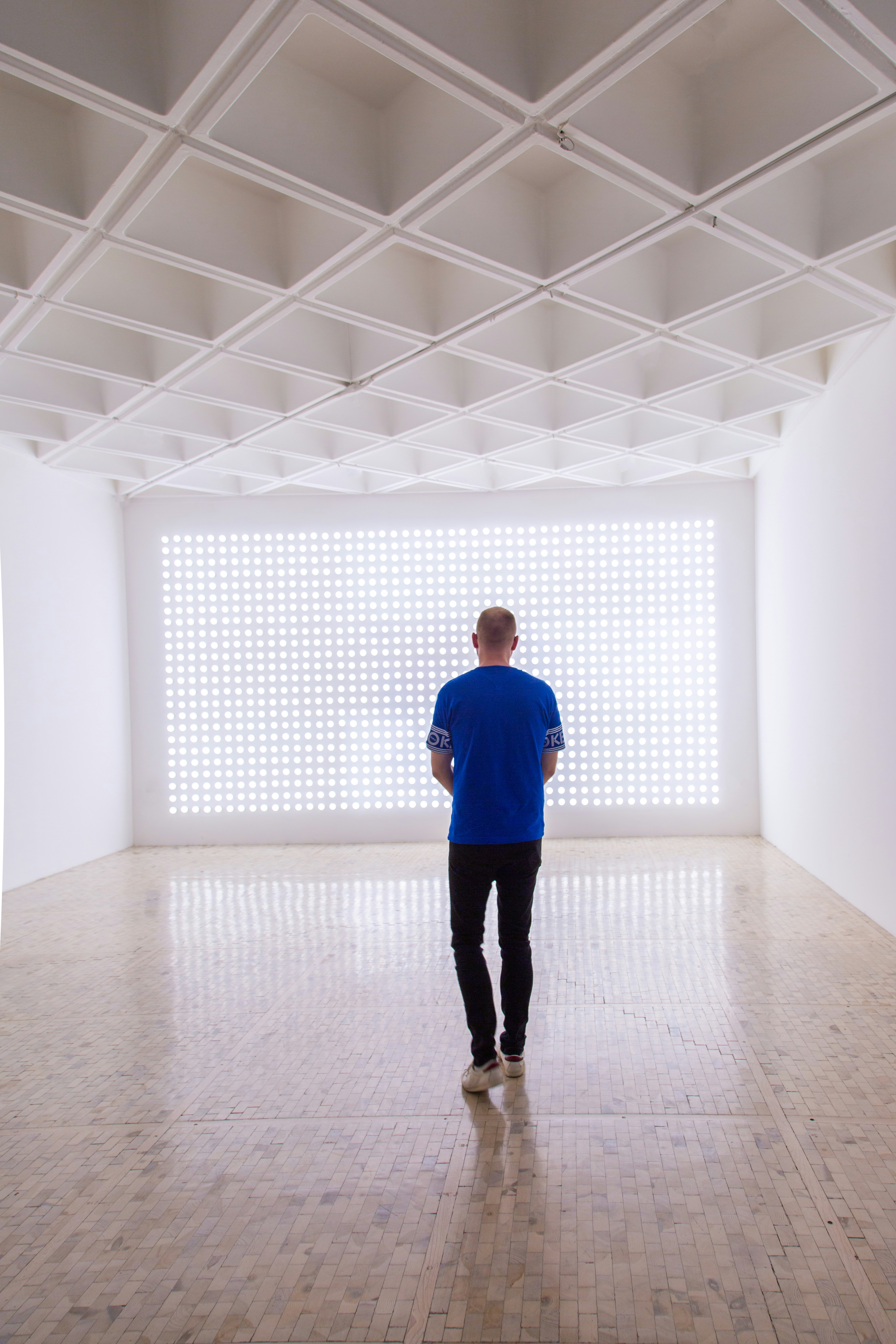 Man standing inside room photo – Free Blue Image on Unsplash