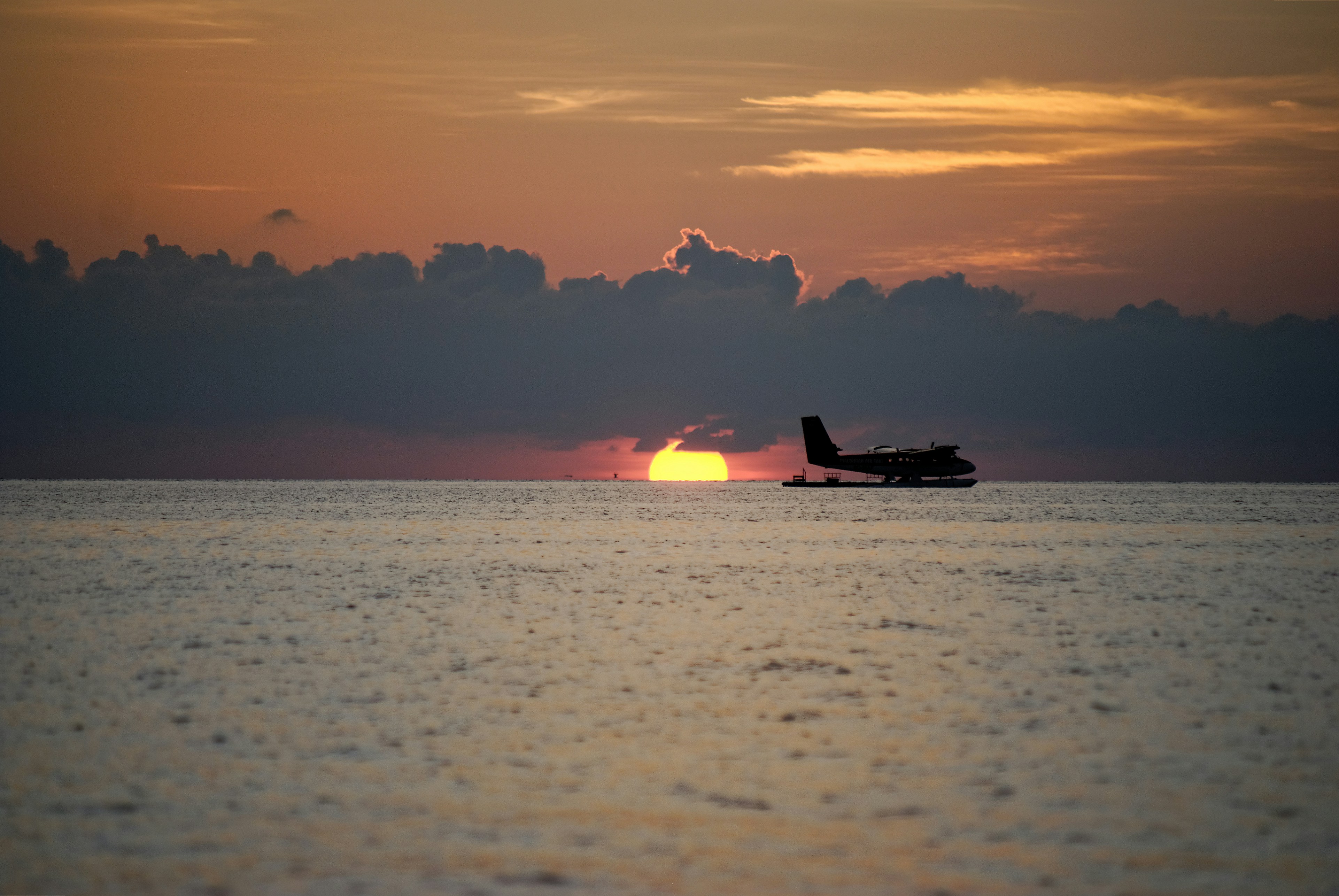 Serenity at Dusk: A Seaplane's Journey