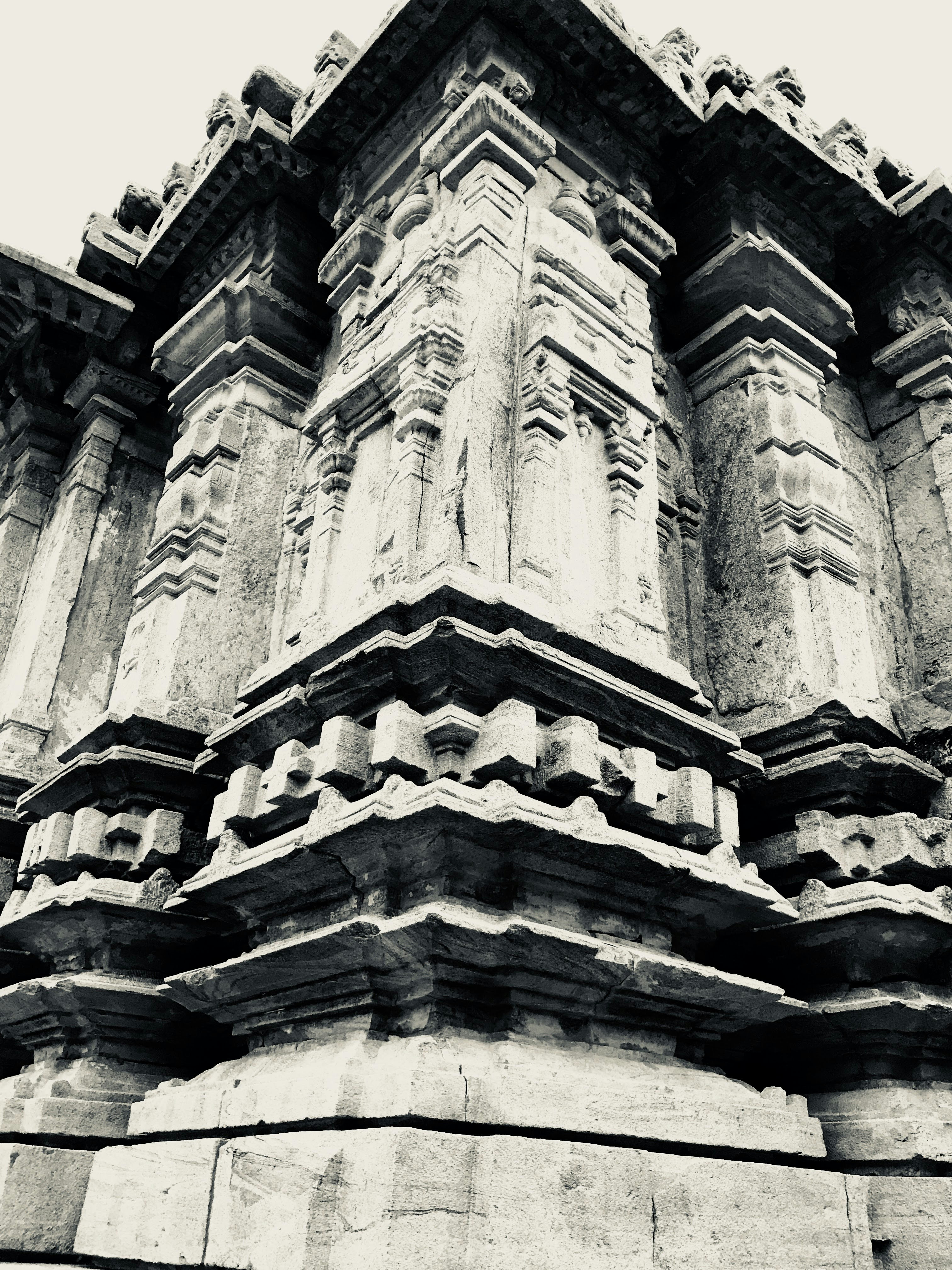 Intricate stone carvings of a historical temple structure showcasing detailed architectural elements.