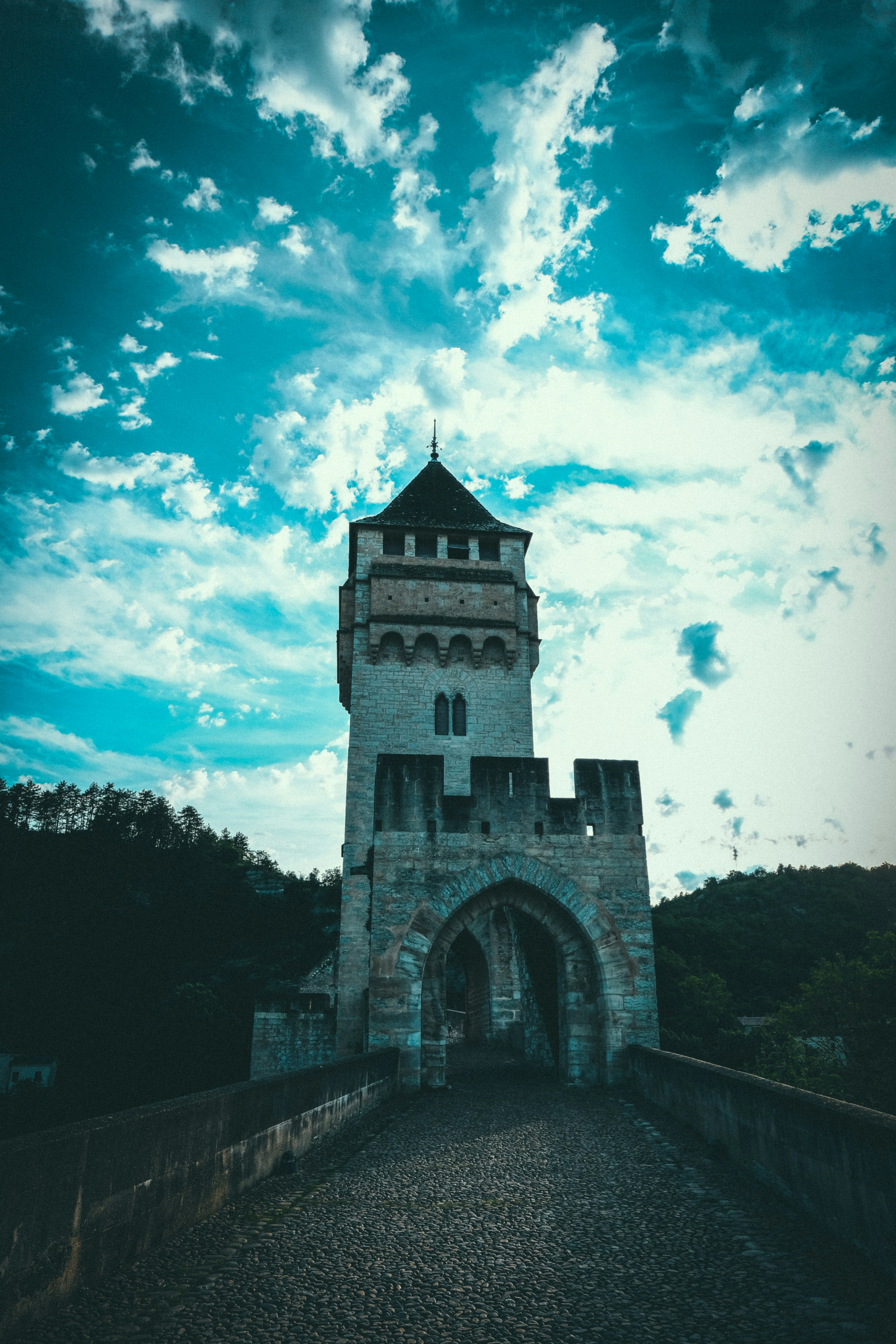 white concrete castle under blue and white sky