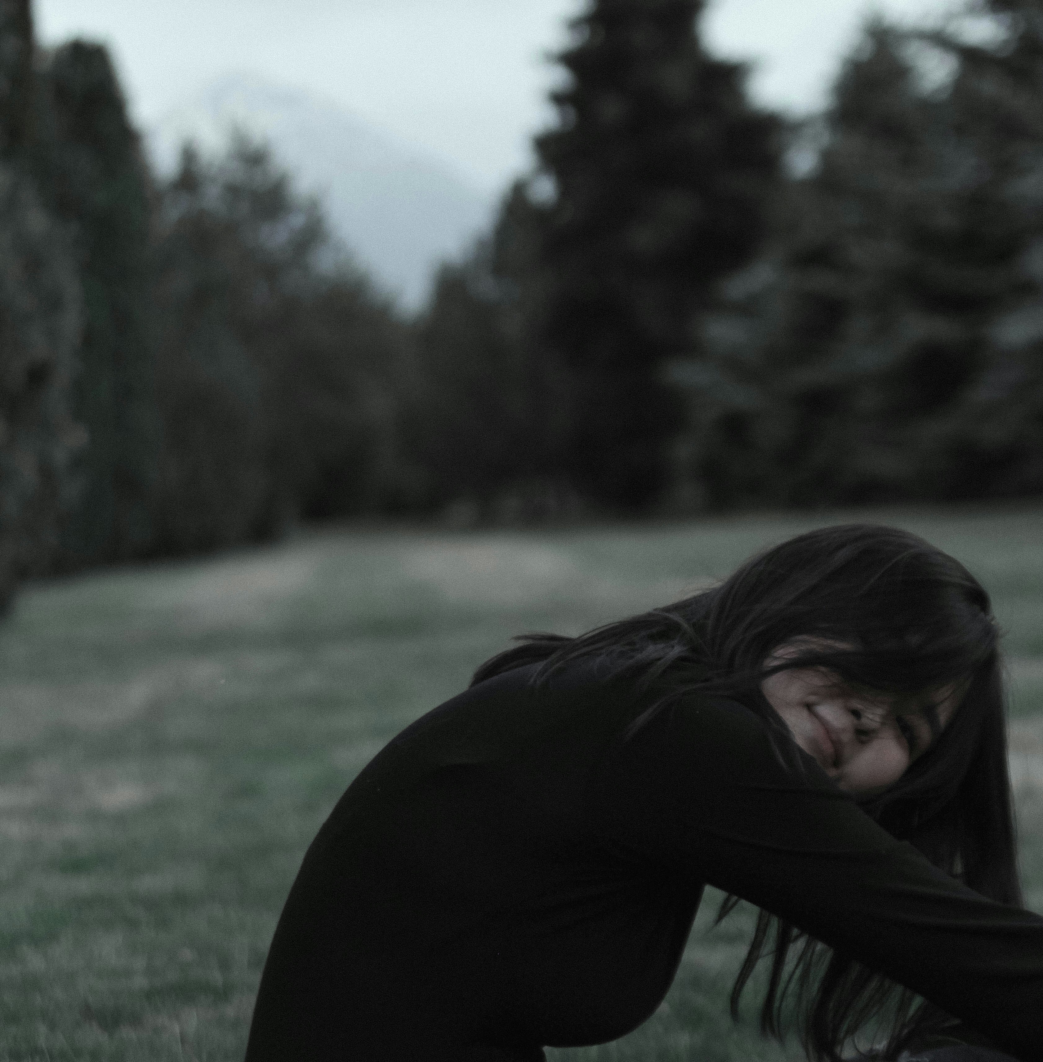 Woman leaning forward near trees photo – Free Model Image on Unsplash