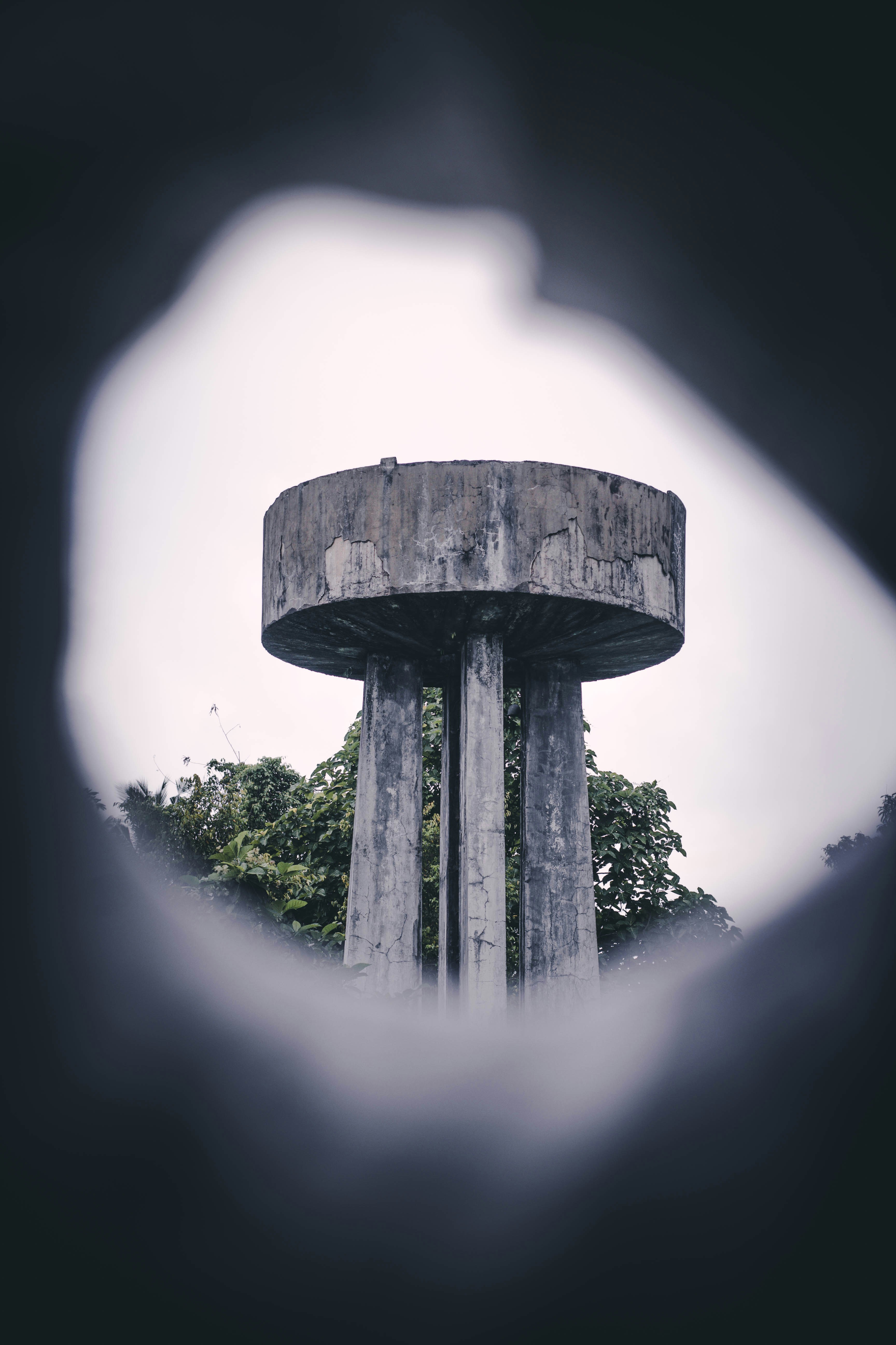 Circular Aperture: Concrete Pillars Framed by a Hidden View