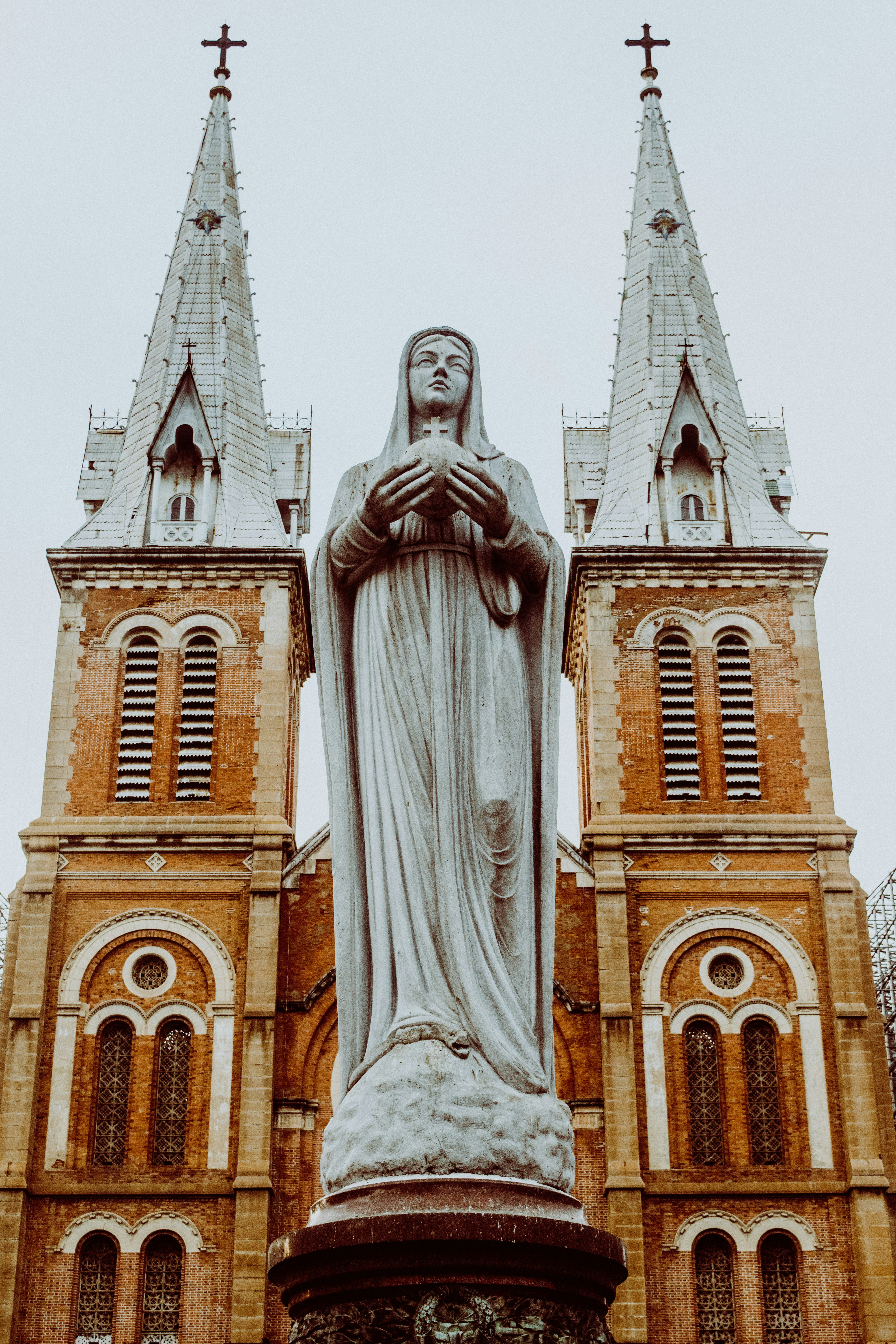 Stone Sentinel Between Twin Spires: Virgin Mary in Quiet Grandeur