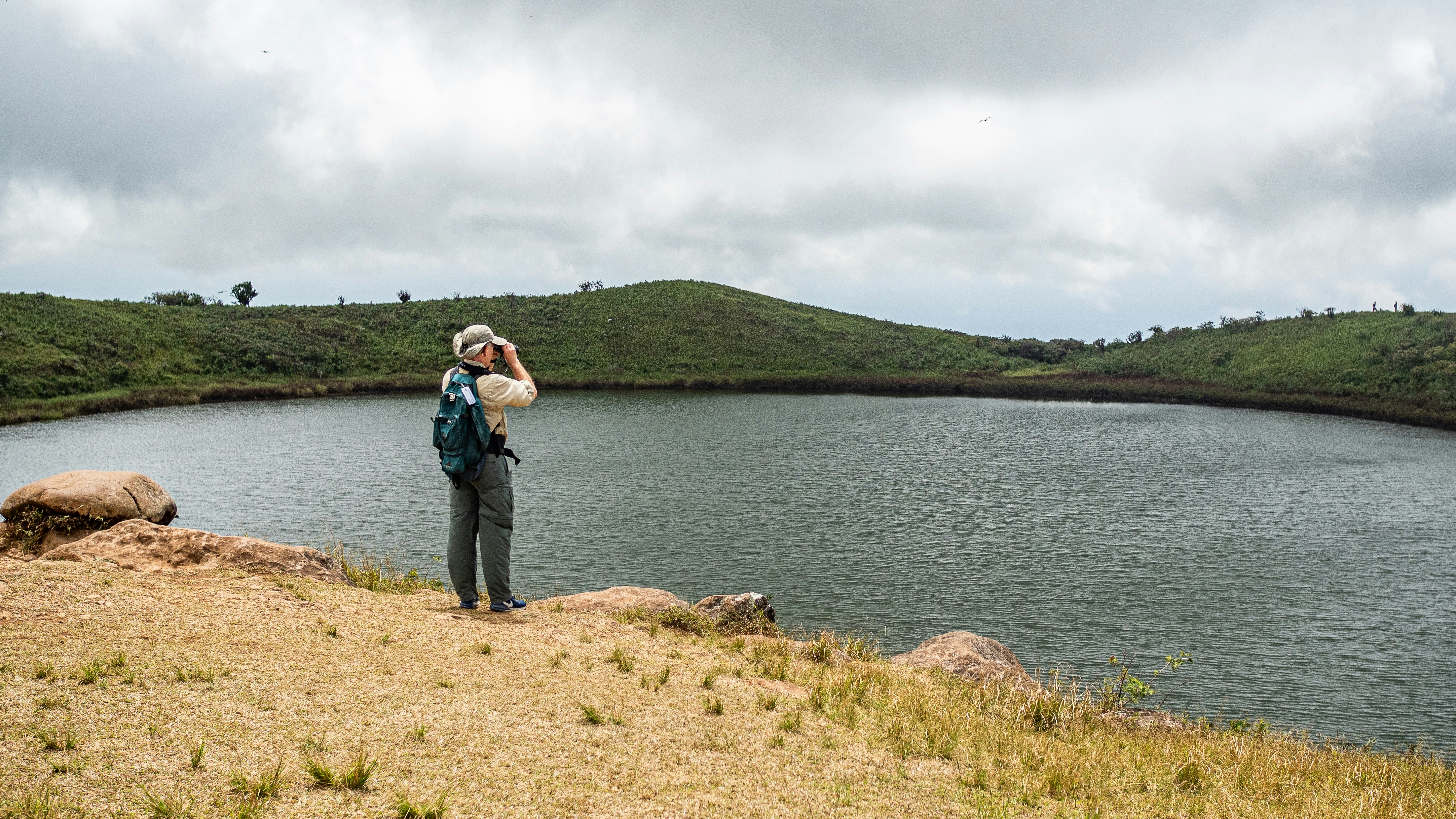 Lone Explorer by the Lake’s Edge