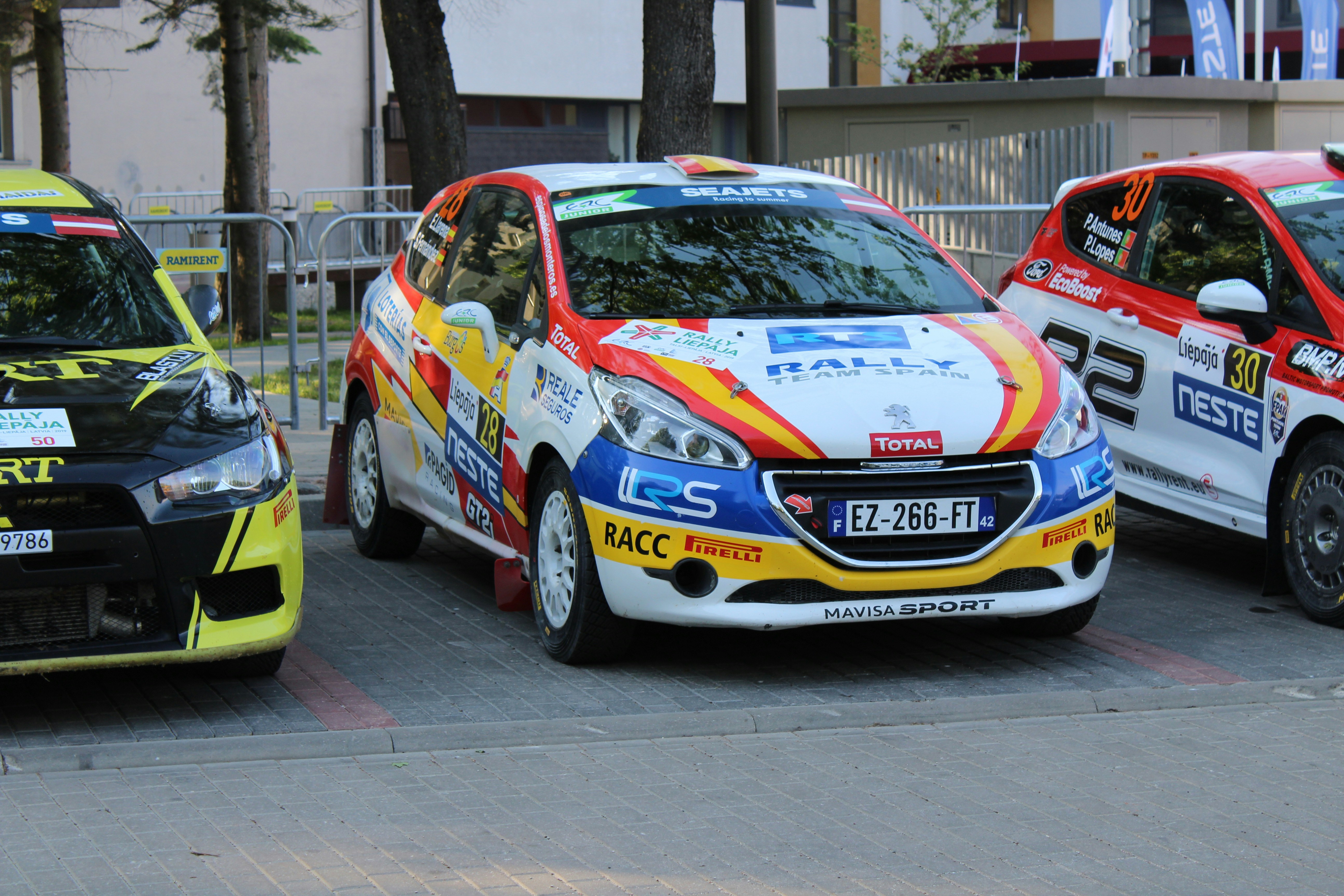 three parked vehicles