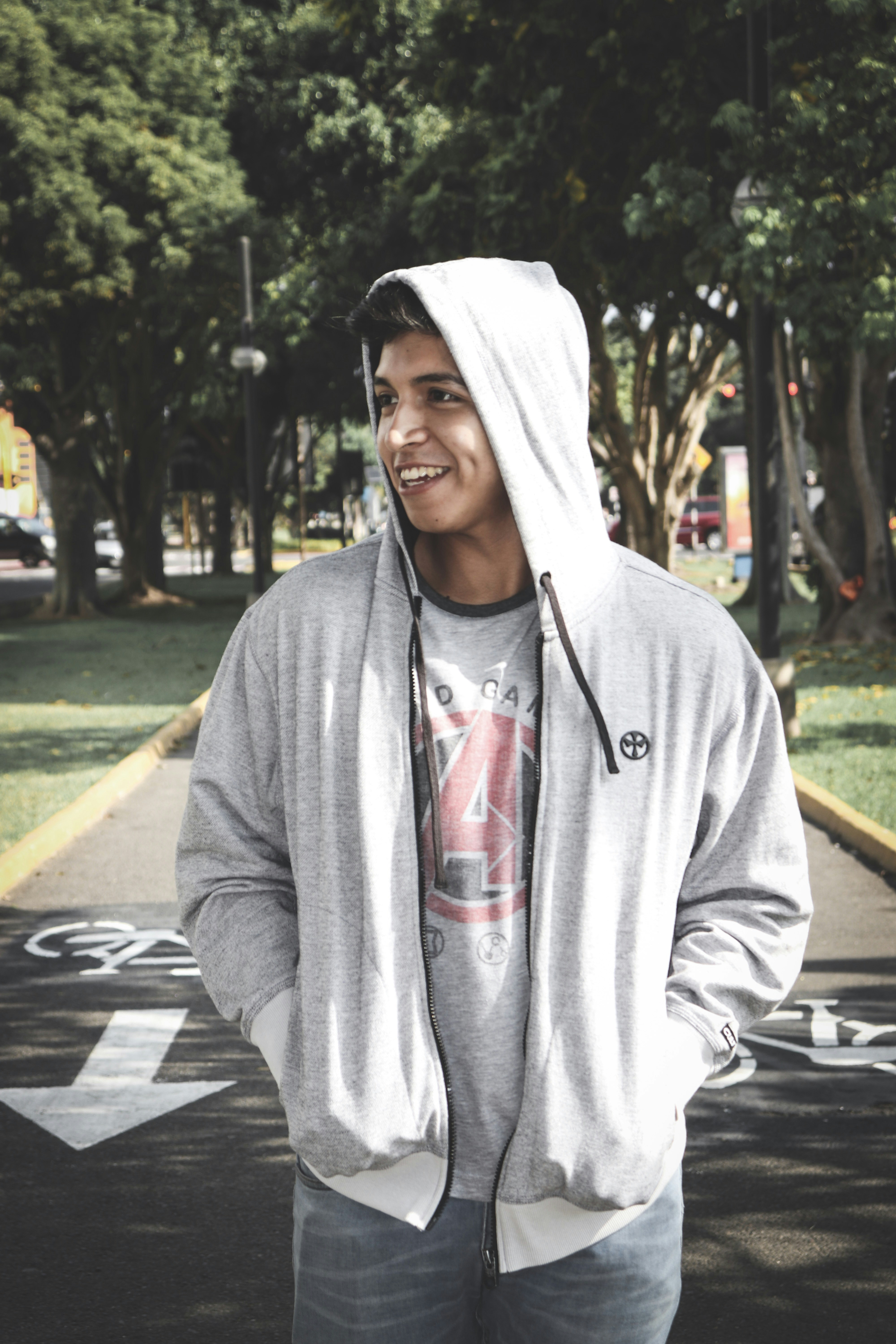 Smiling man standing and looking his right side photo – Free Man Image ...