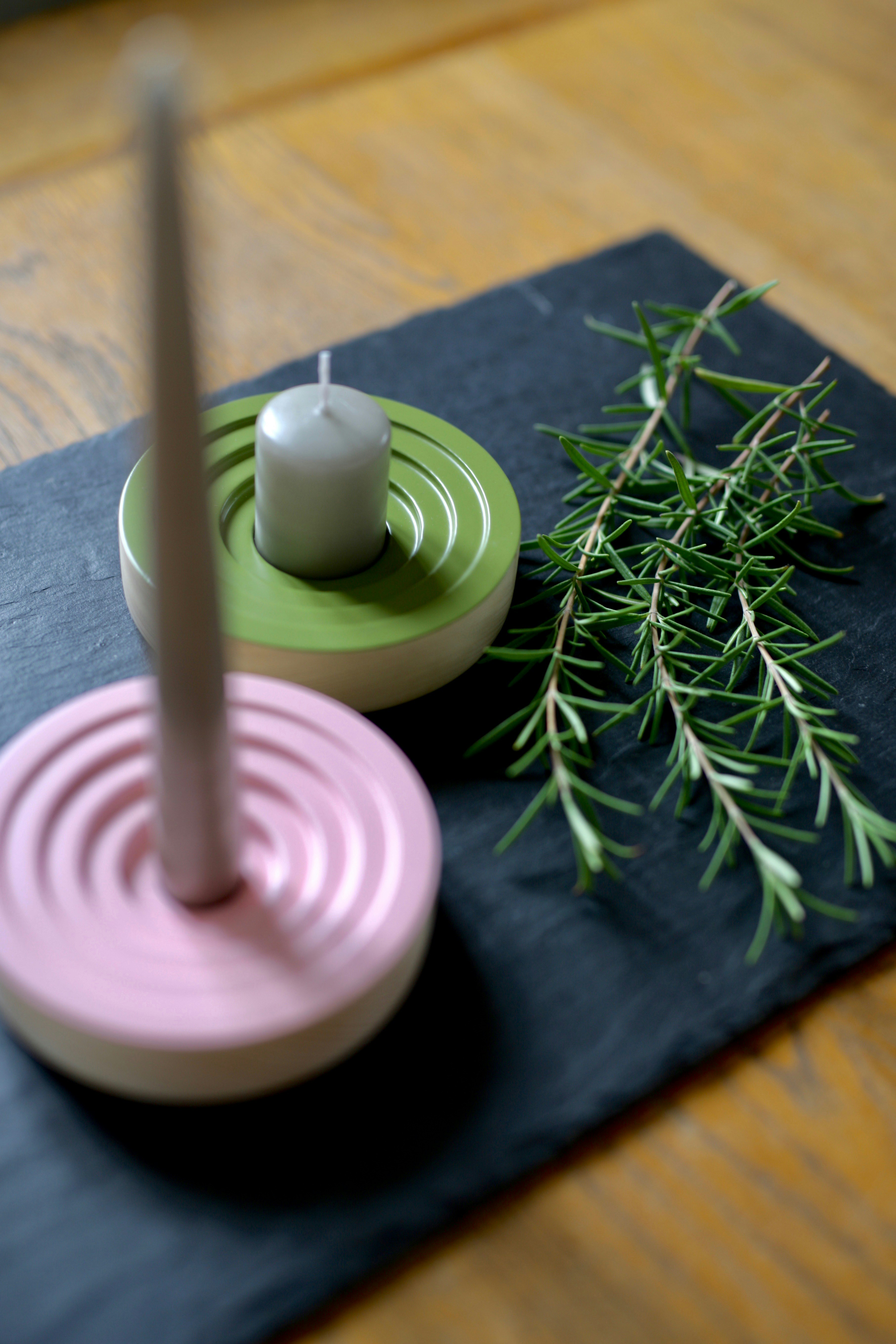 Concentric Candles and Rosemary: A Slate Still-Life