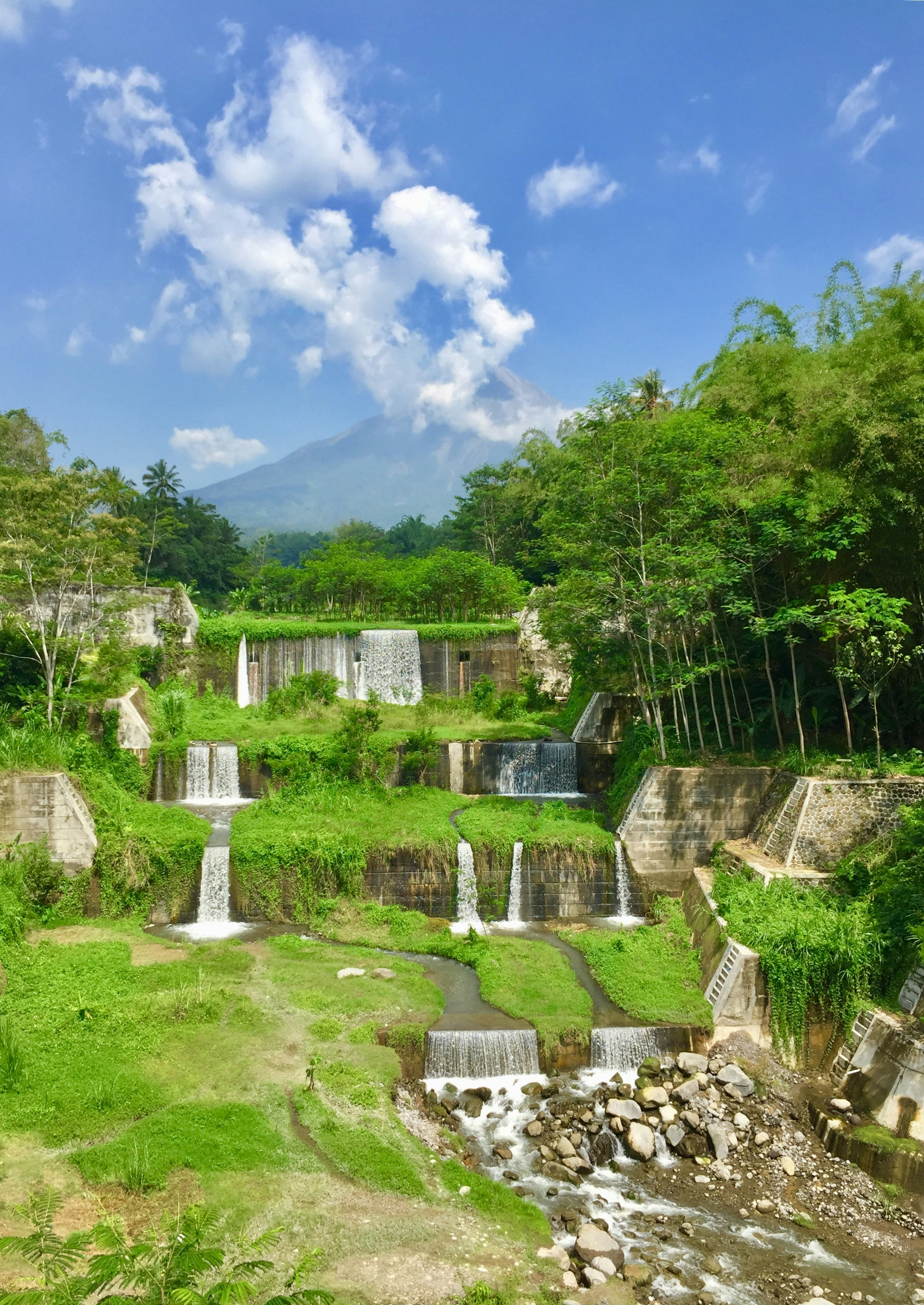 Cascading Serenity Amidst Verdant Hills
