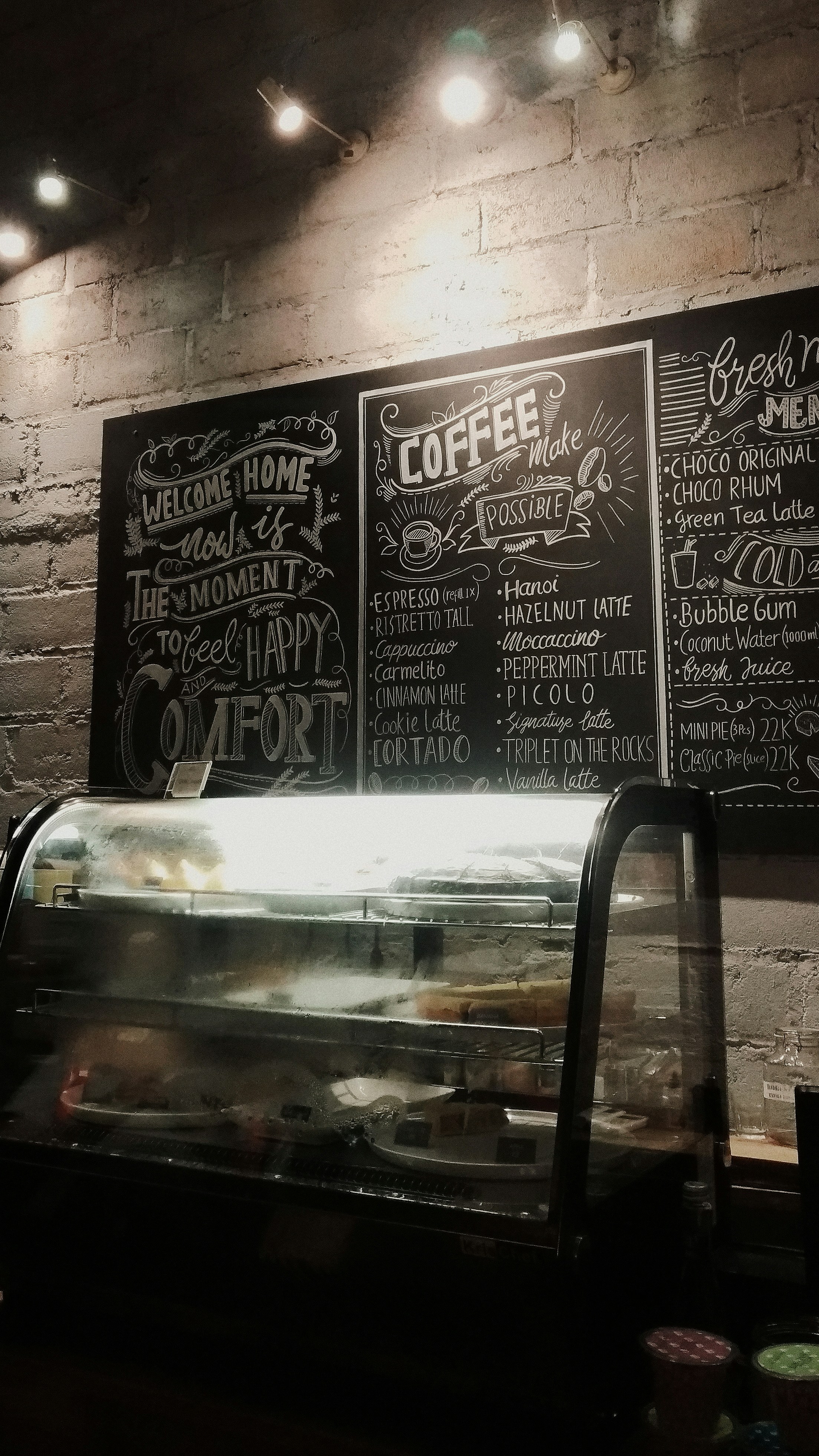 Chalkboard Coffee Tales Over a Glassed Display