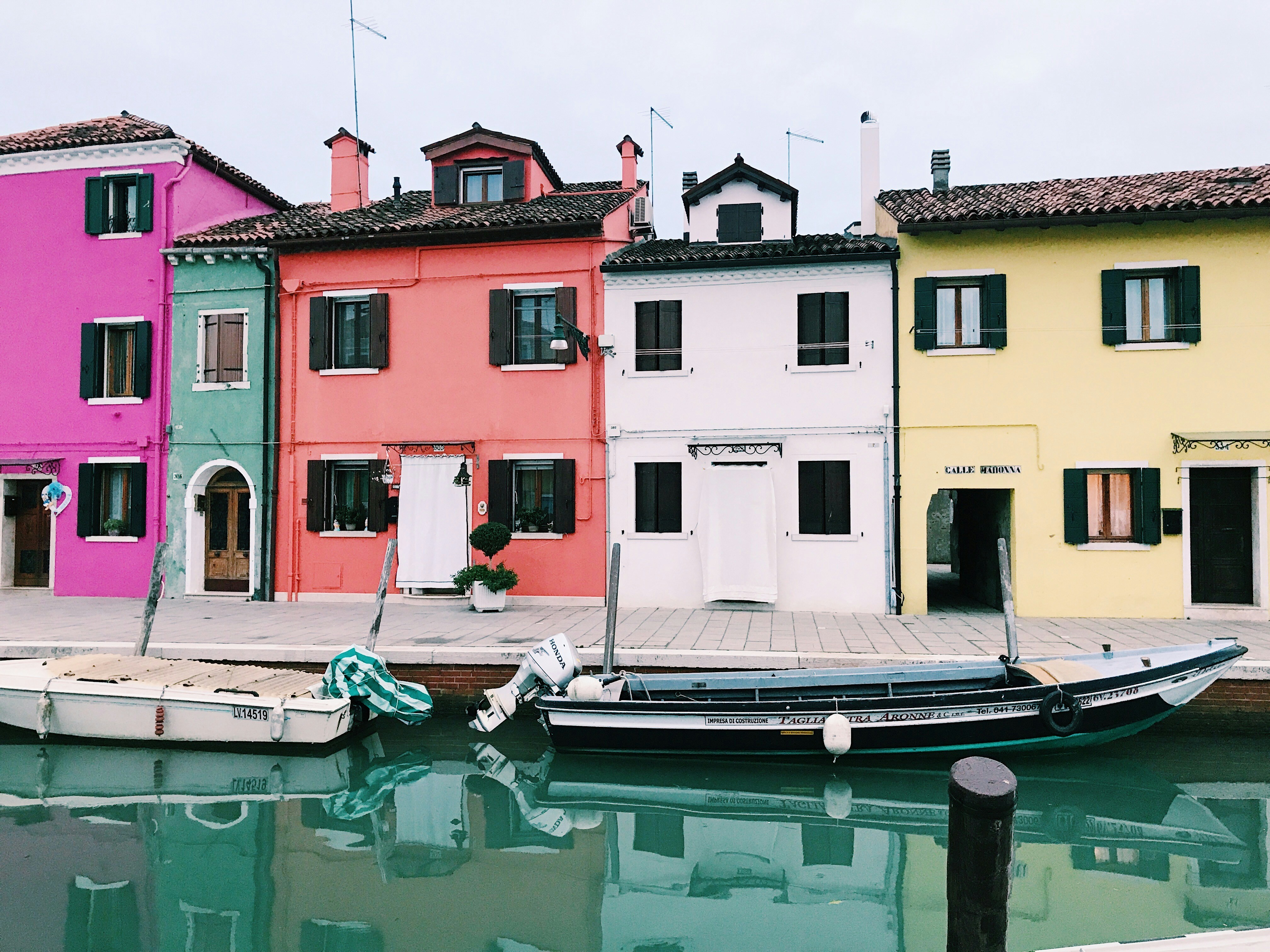 Candy-Colored Canalfront: Pastel Facades and Reflections