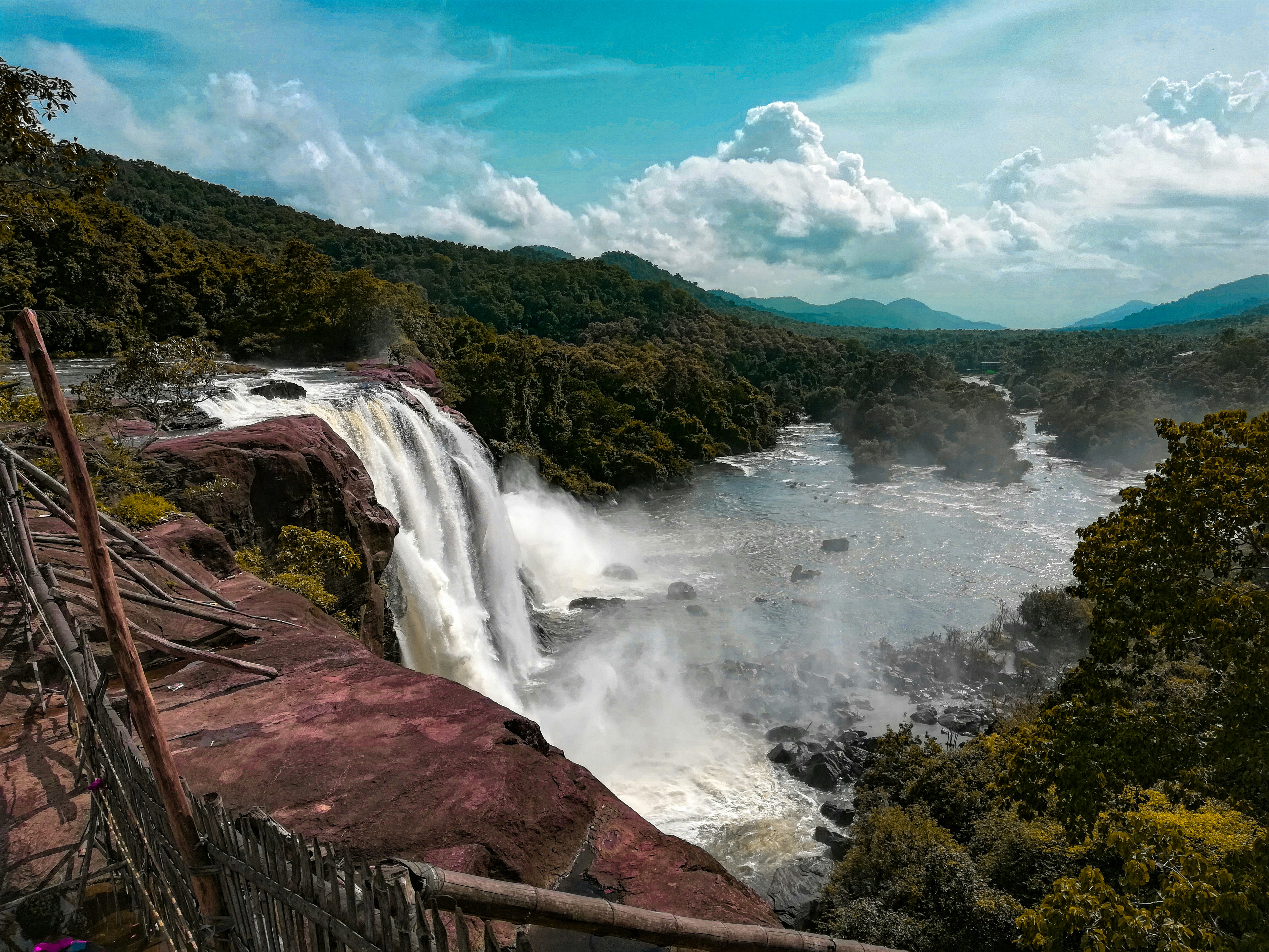Mist on the Edge: Cascade over the Red Stone Gorge