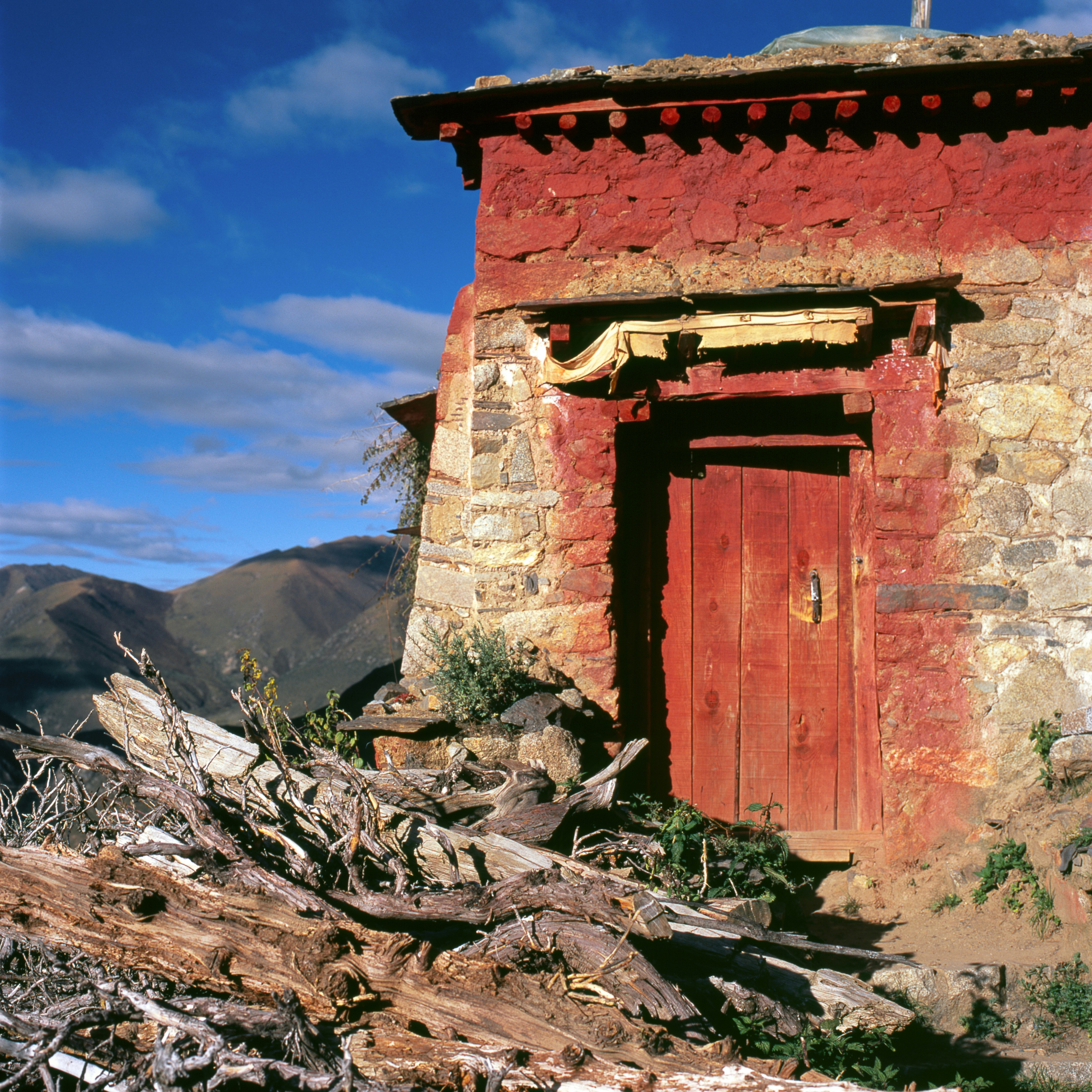 Red Gatehouse on a Mountain Ridge