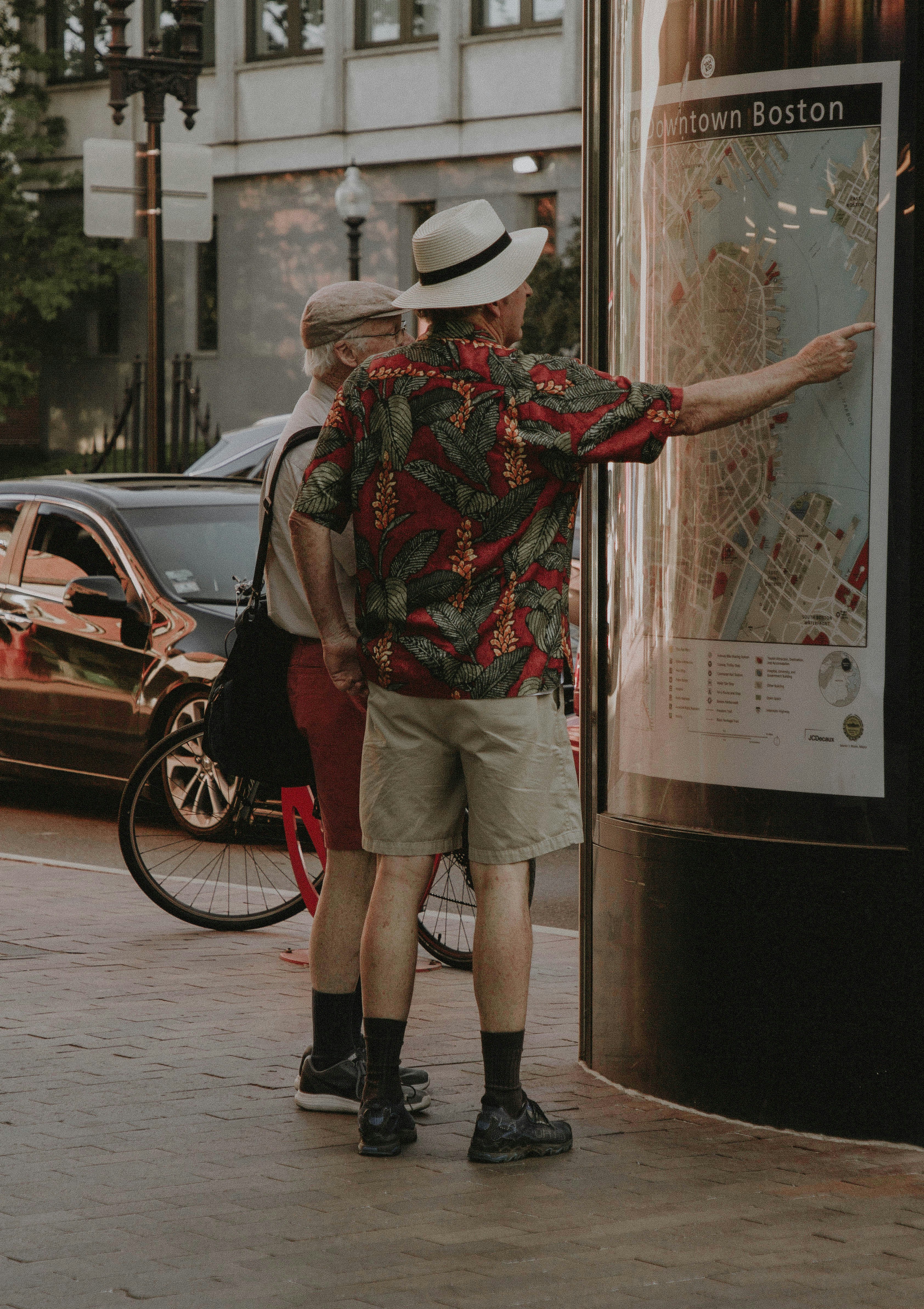 Two men looking at white poster photo – Free Apparel Image on Unsplash