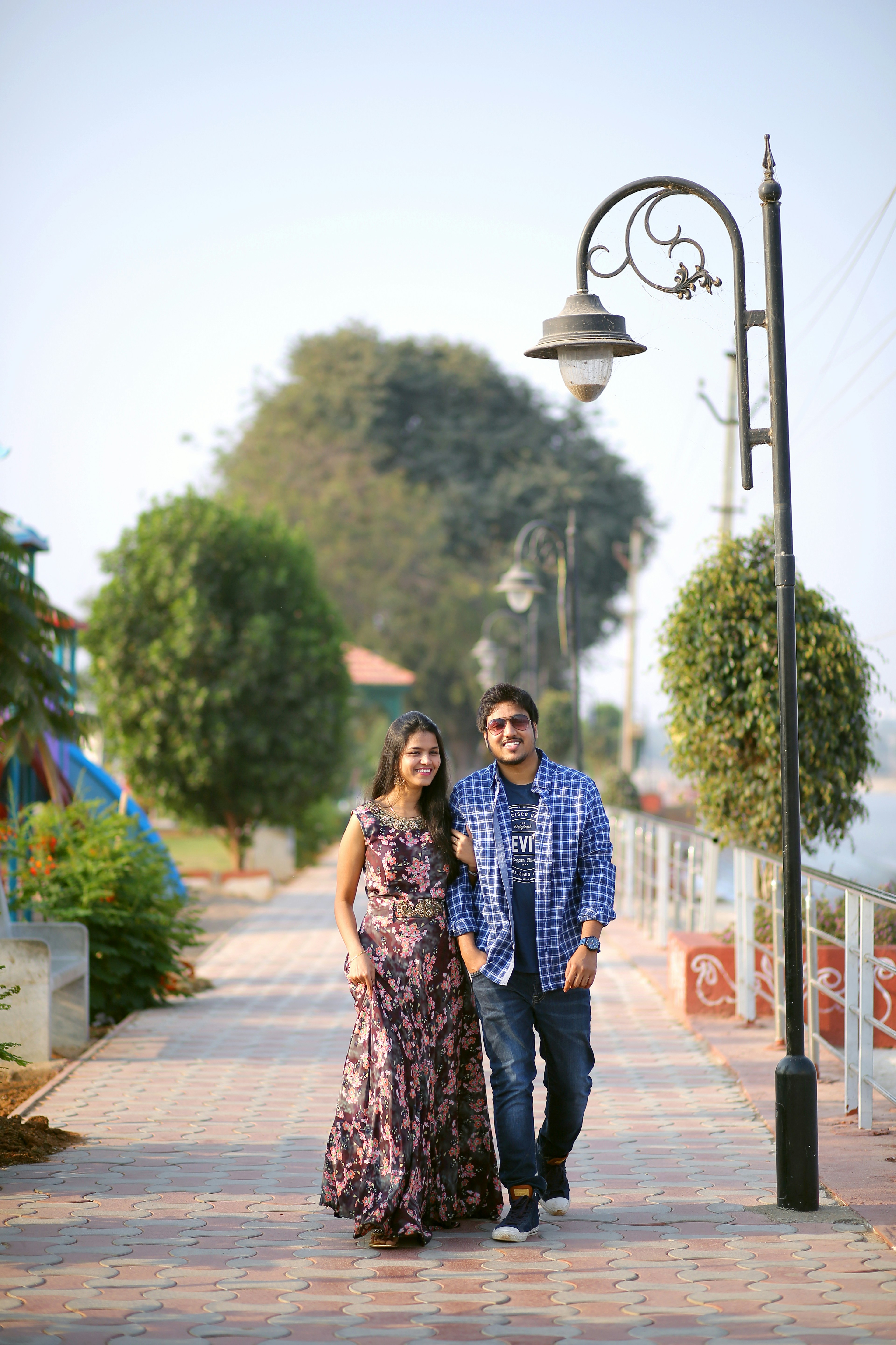 man and woman beside light post