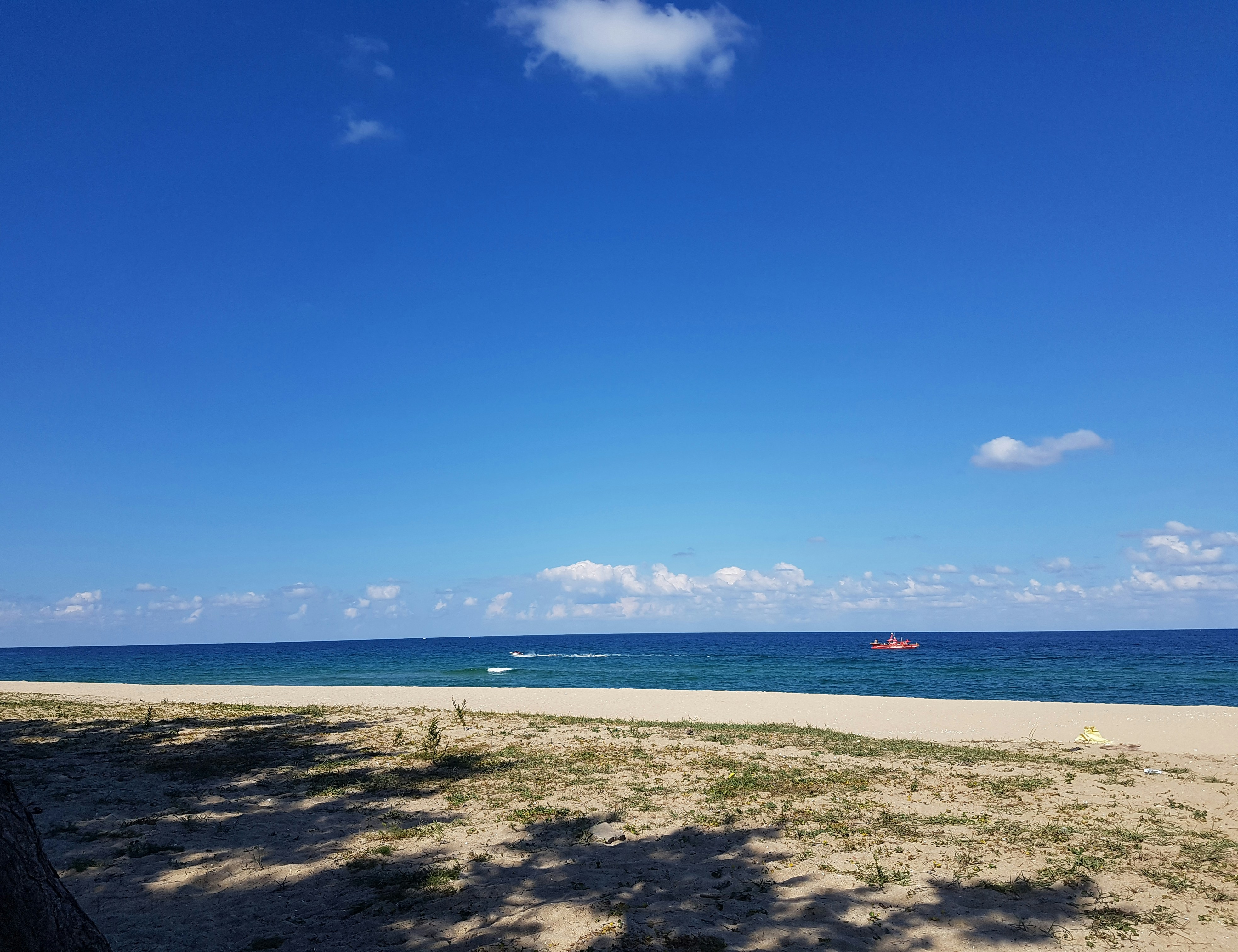 Distant Vessel on a Cerulean Horizon