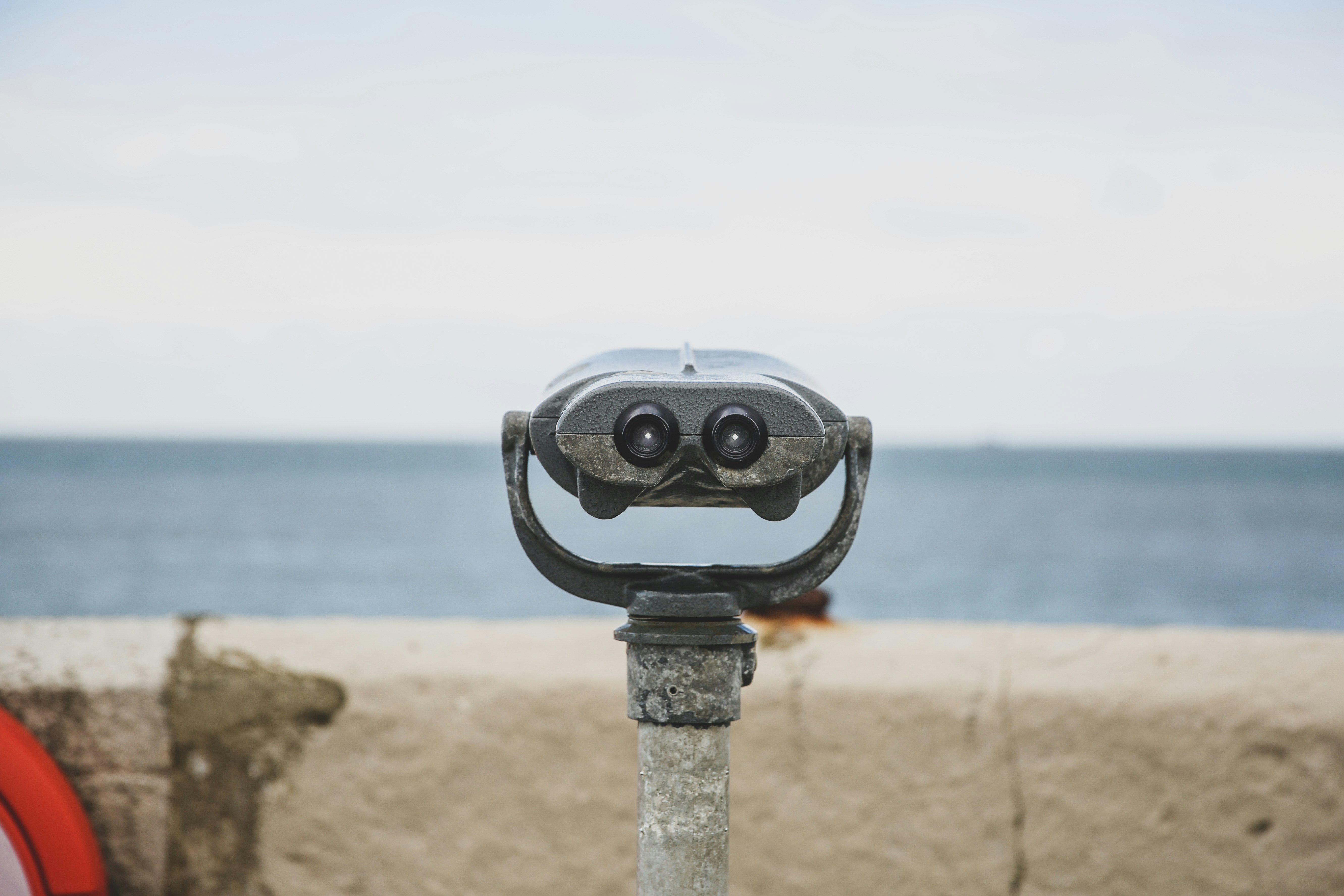 Seaward Gaze: A Weathered Viewfinder Framing the Quiet Horizon