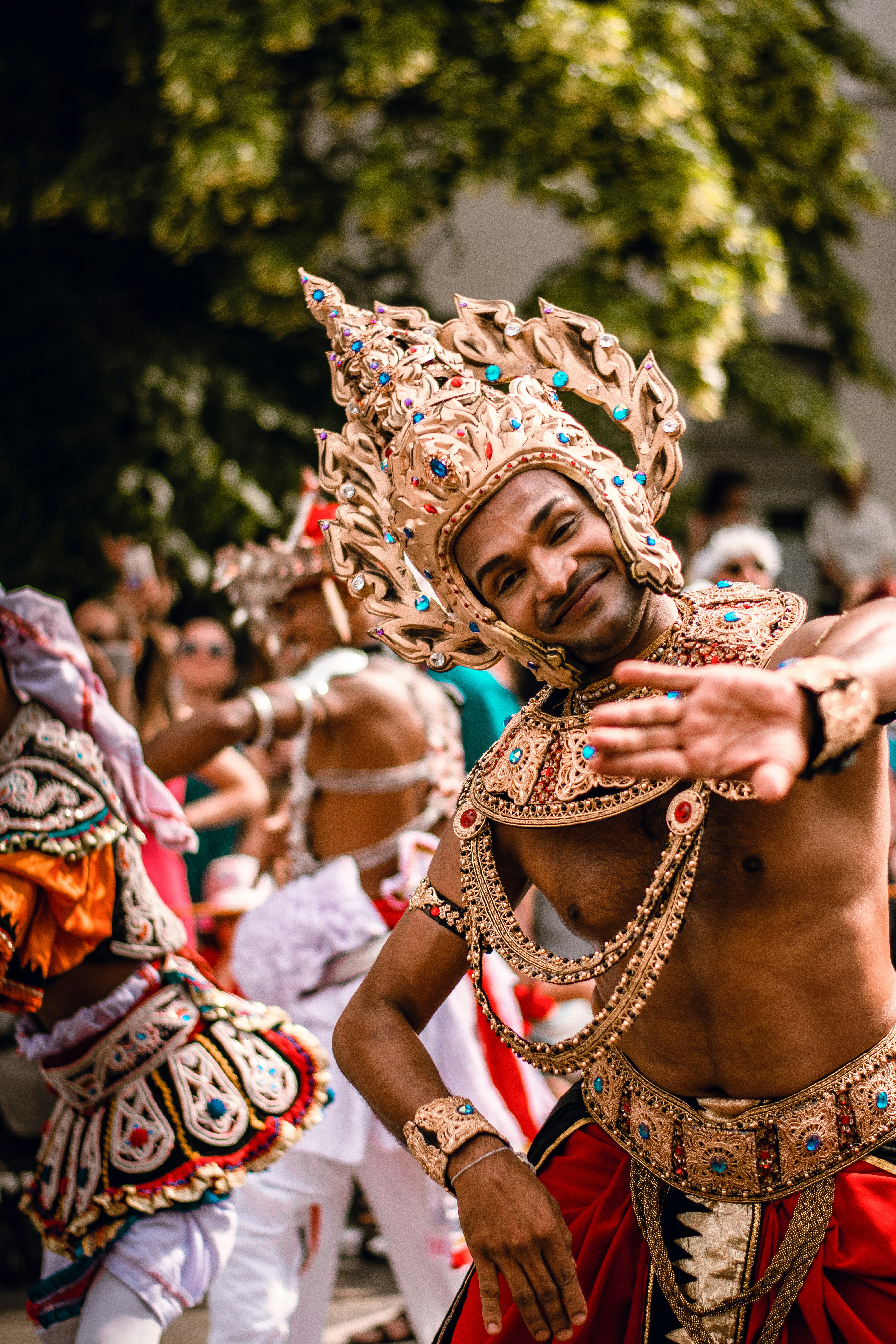 Men with golden headdresses dancing on street photo – Free Pieace Image ...