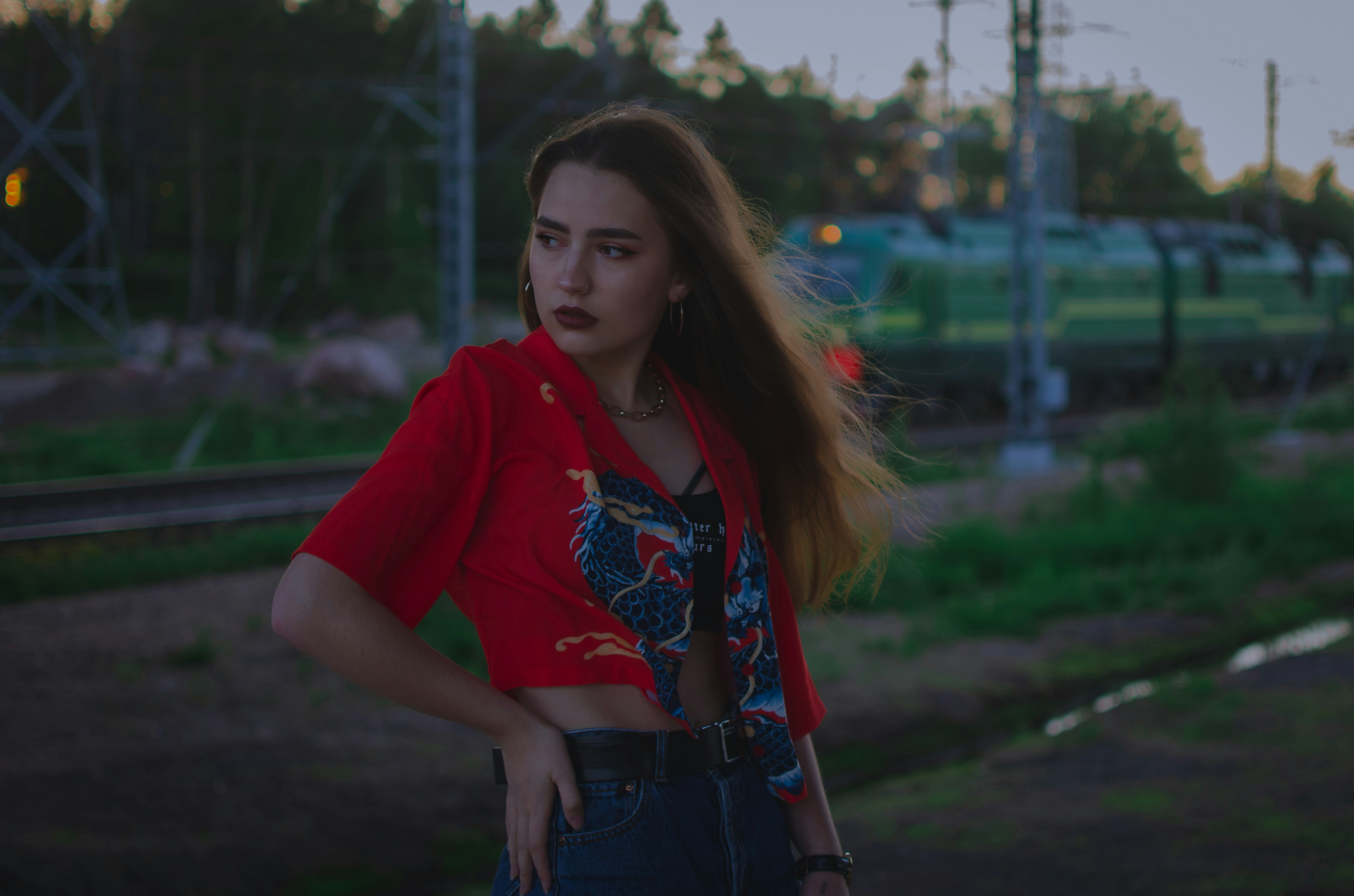 Woman standing with right arm akimbo looking her right side photo ...