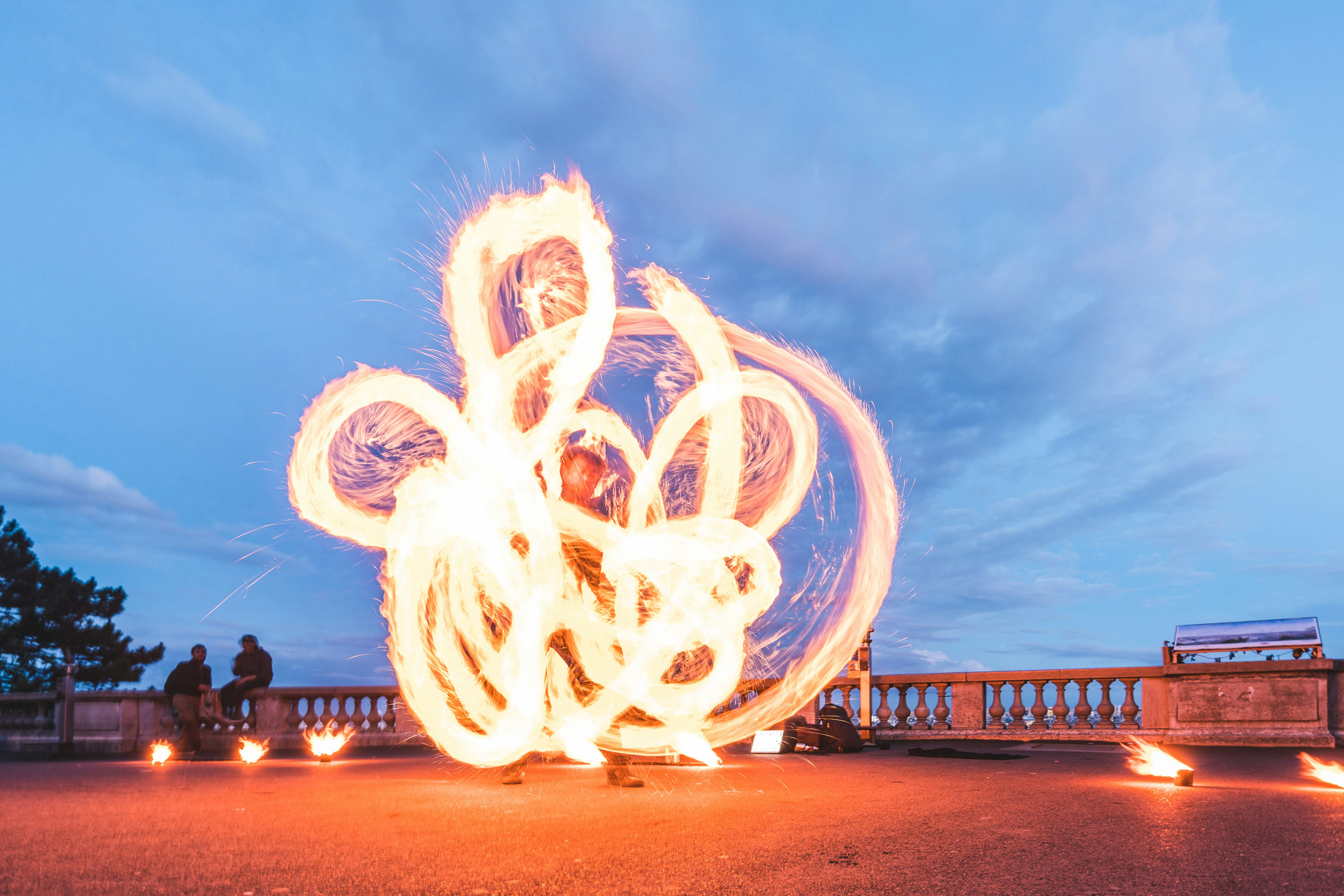 Orbital Flames: A Night of Fire Dancing on a Terrace