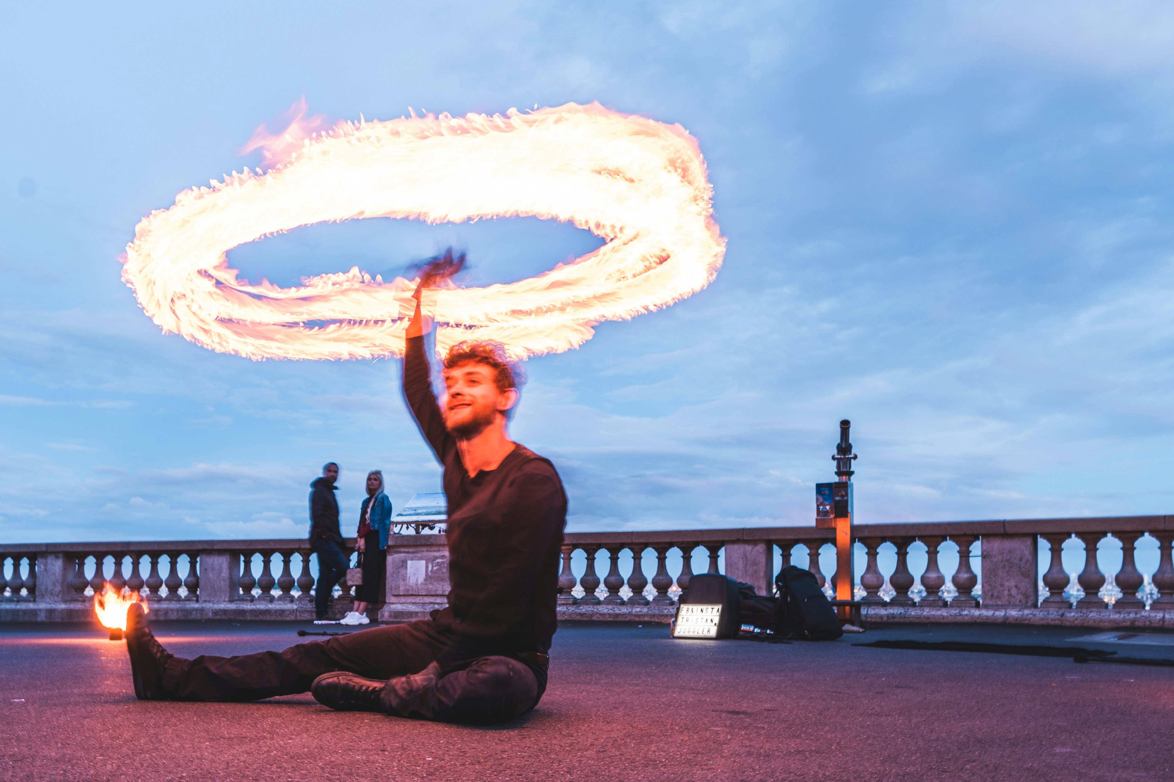 Fire Ring Rider: A Solo Spinner Under the Evening Sky